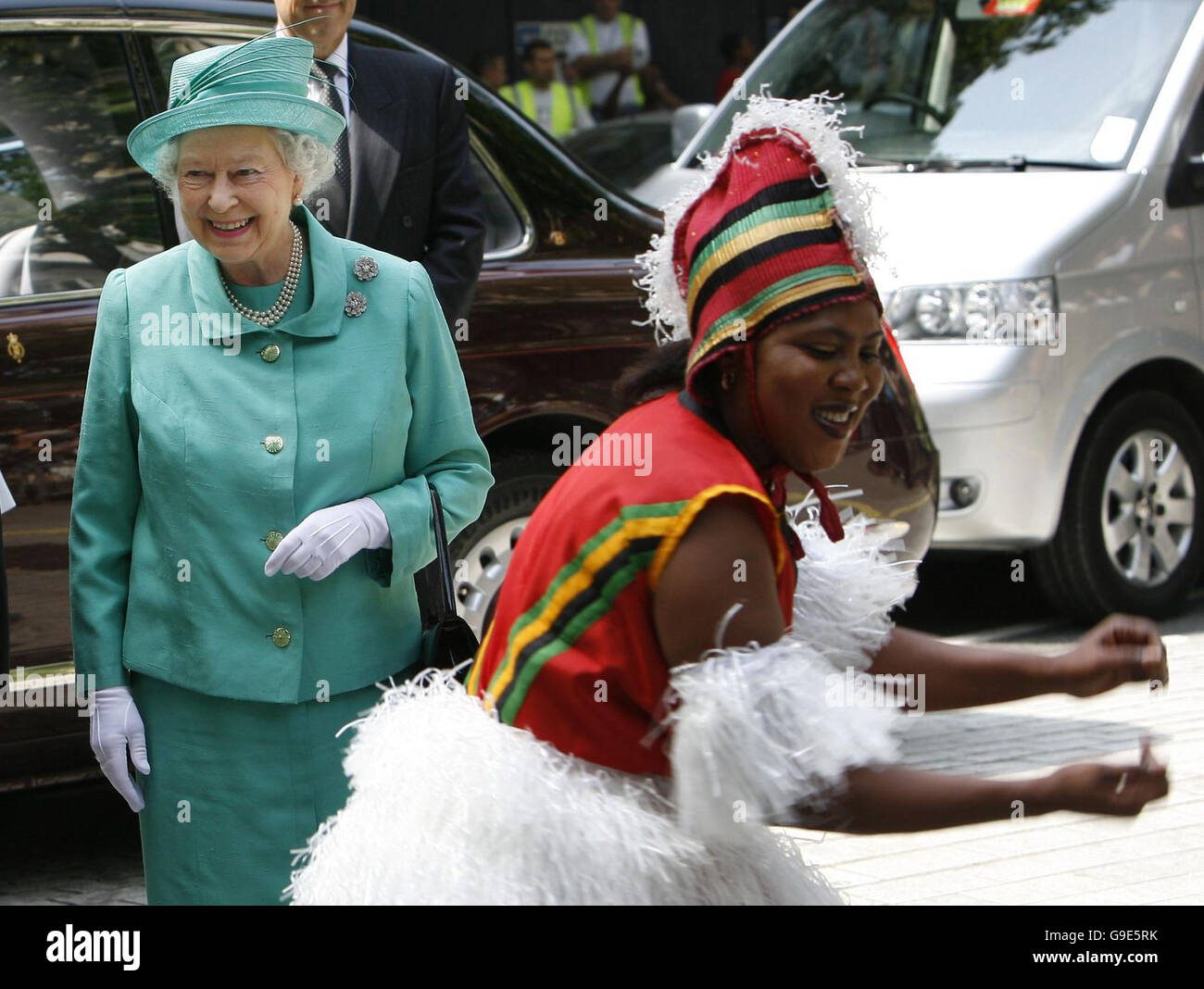 Britain's Queen Elizabeth II watches traditional dancers perform as she ...