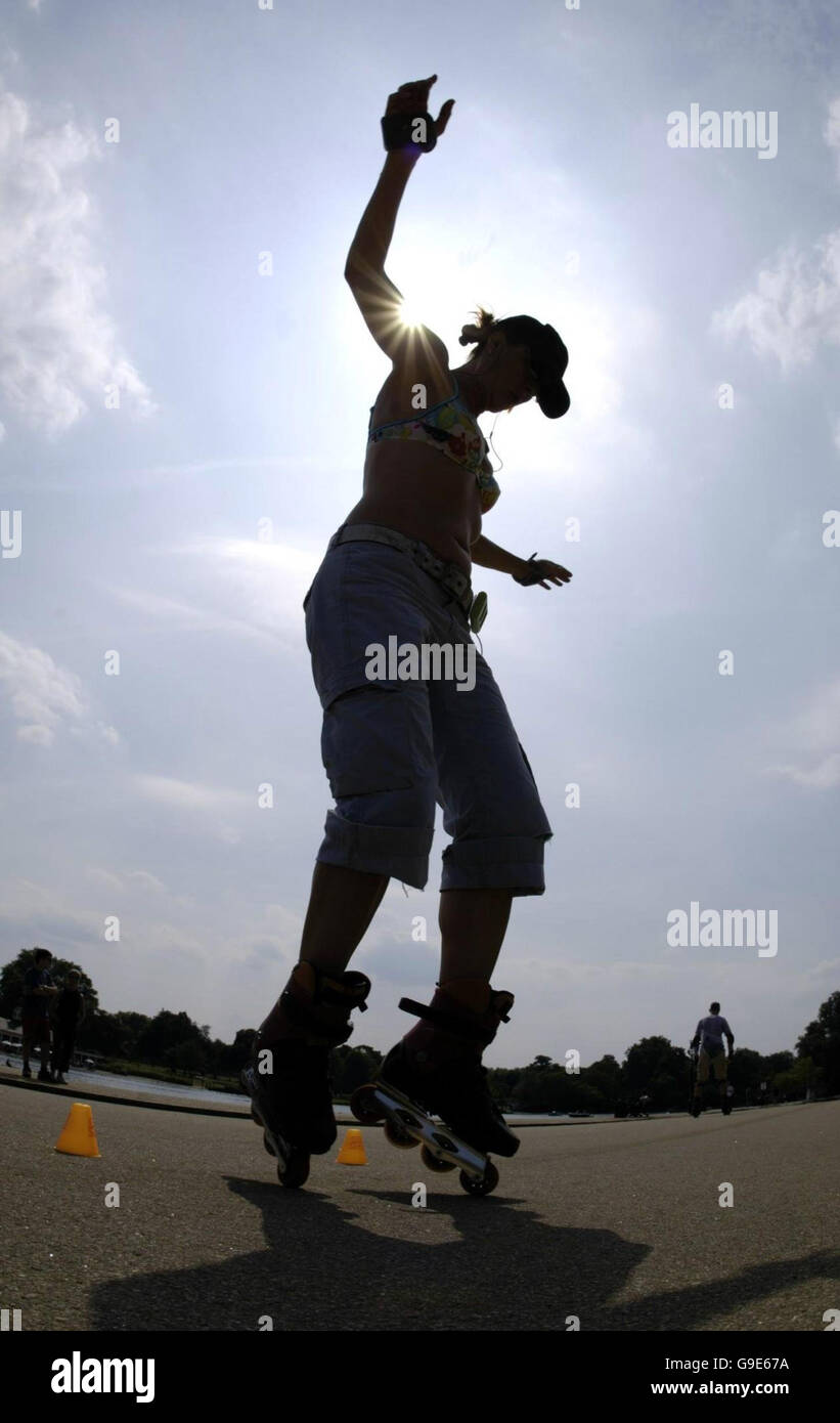 A rollerblader practises her slalom moves in Hyde Park as the hot ...