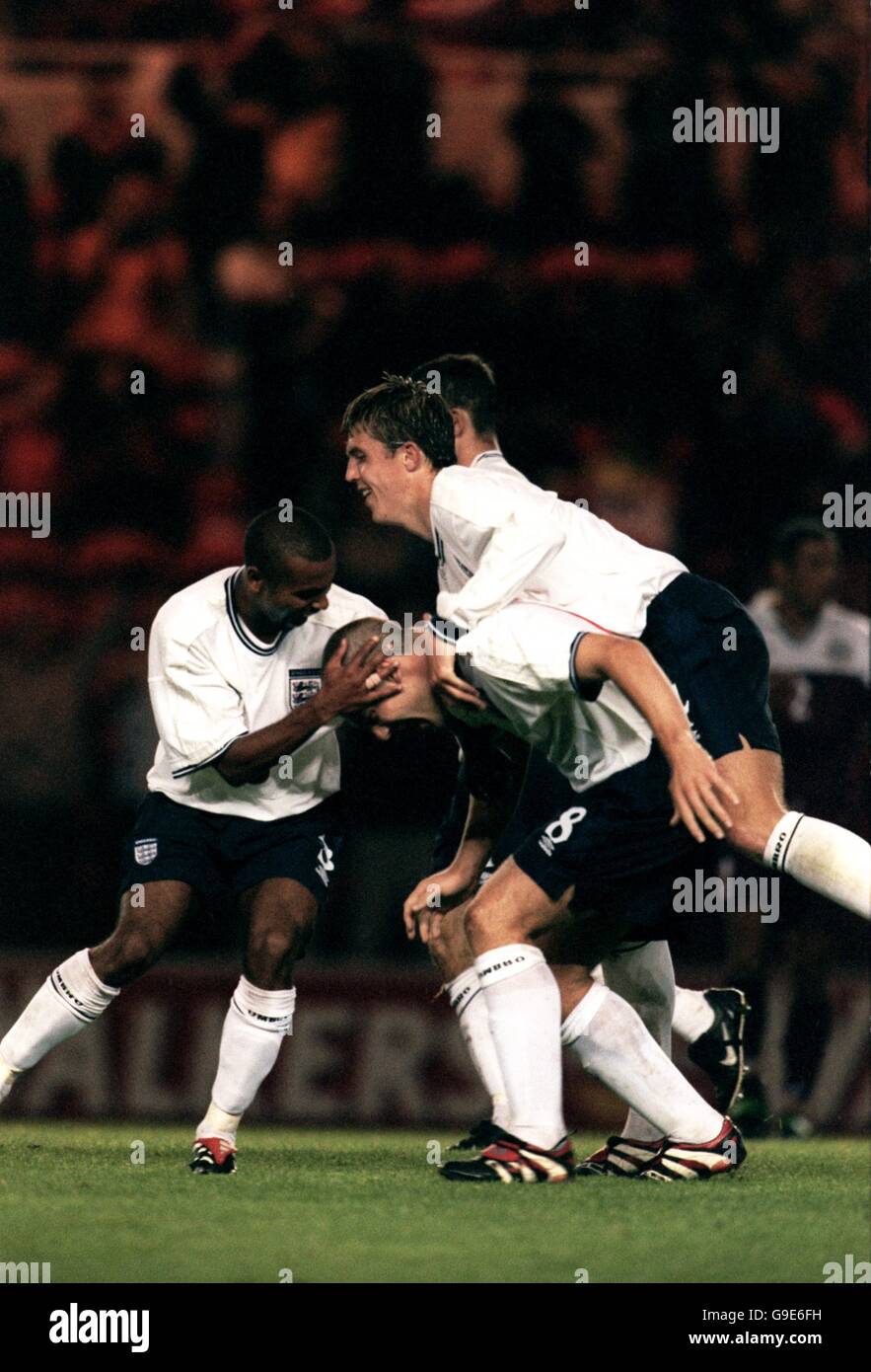England captain David Dunn (c) celebrates with teammates after scoring ...