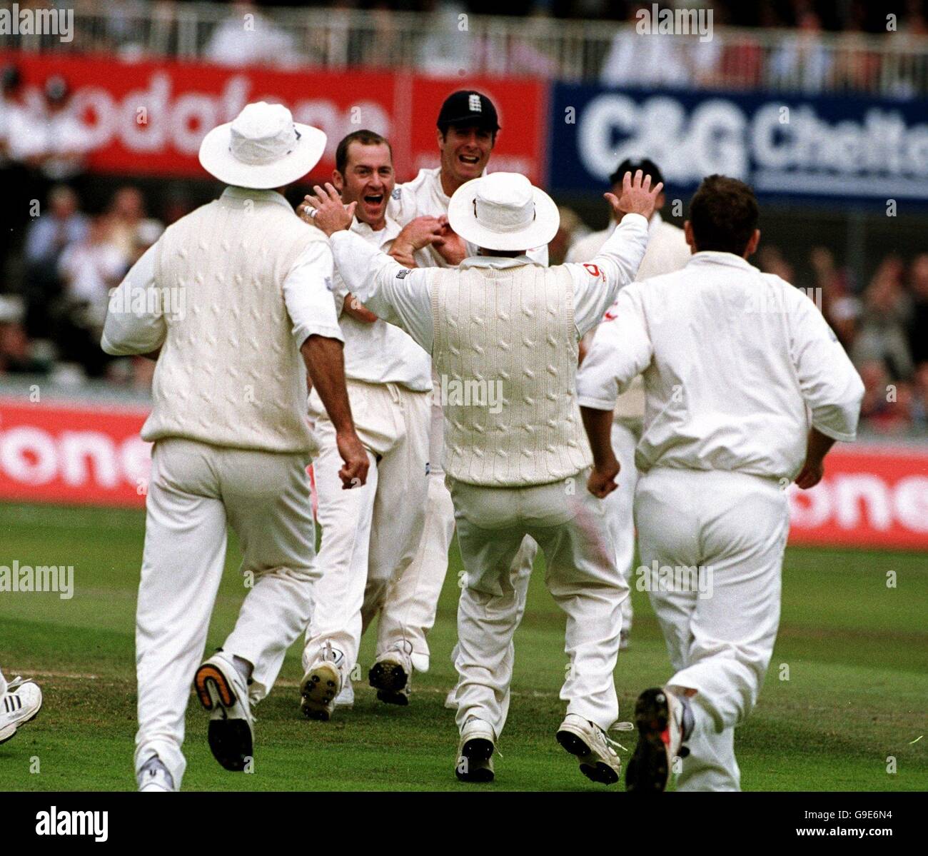 England players rush to congratulate Craig White on taking the wicket ...