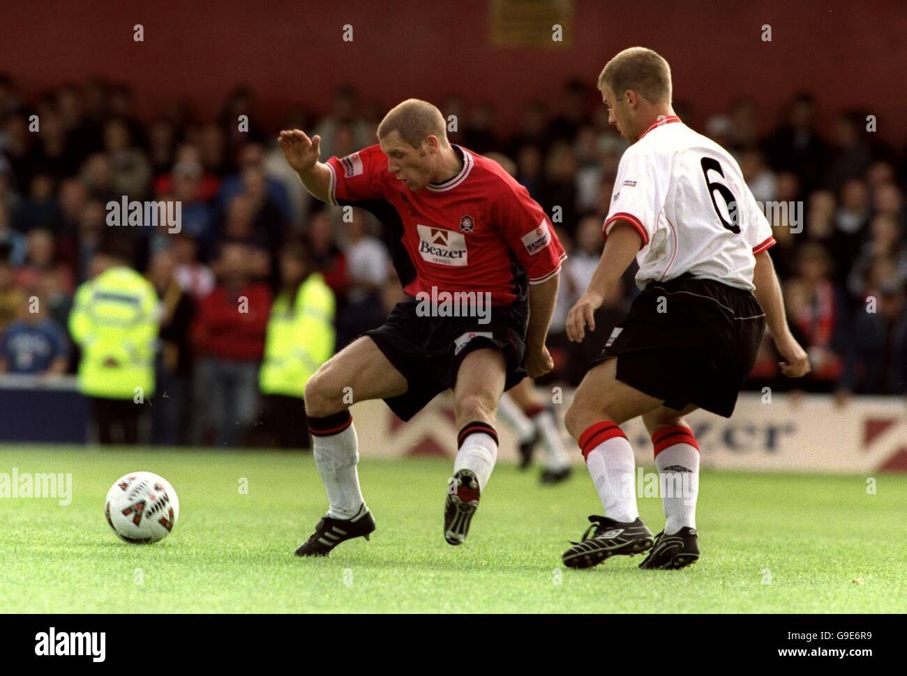 Doncaster Rovers' Jamie Patterson (l) takes the ball away from ...