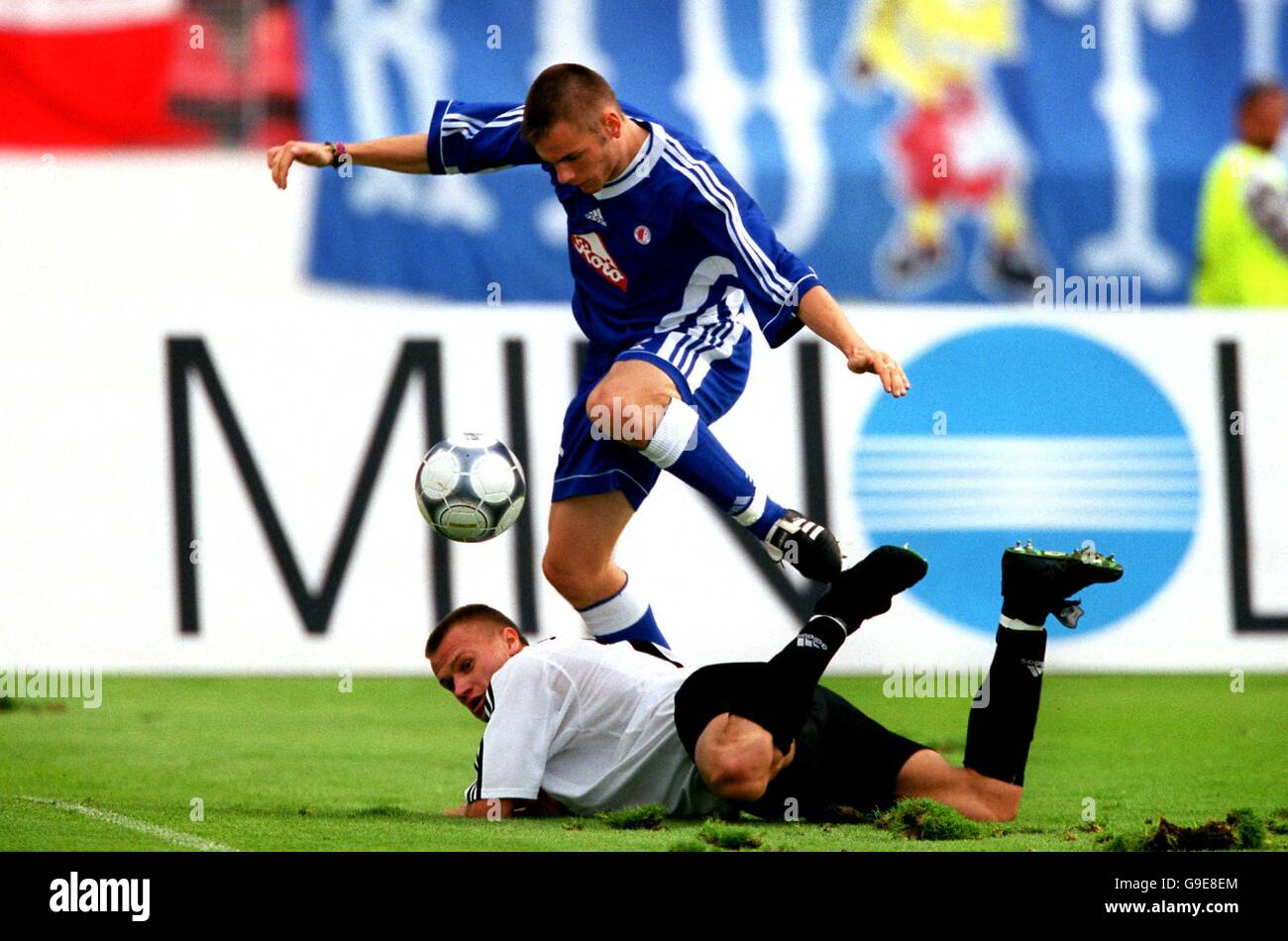 Slavia Prague's Lukas Dosek hurdles the body of Shakhtar Donetsk's ...