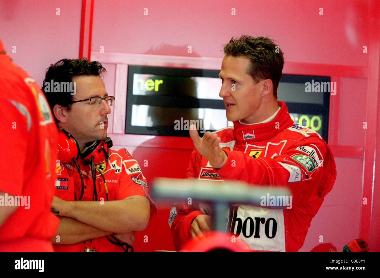 Michael Schumacher chats to his race engineer after setting second ...