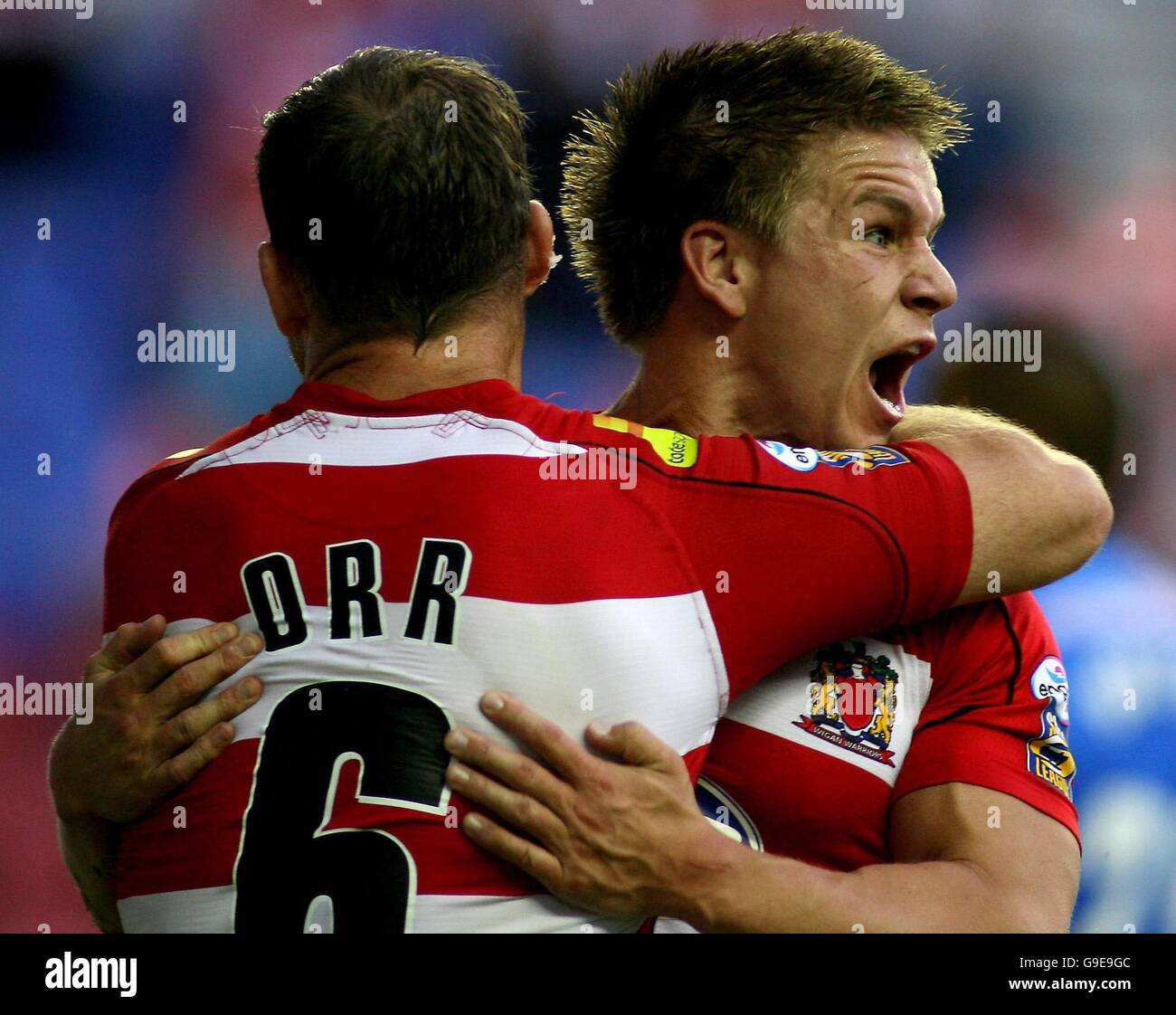 Wigan's Danny Orr celebrates his try with teammate Wayne Godwin during ...