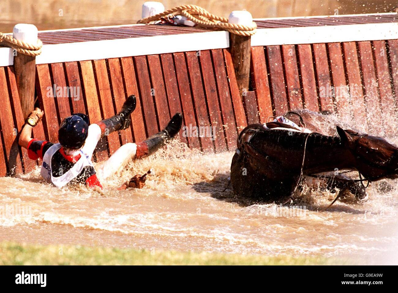 Great Britain's Ian Stark tumbles to the ground after his horse fell in ...