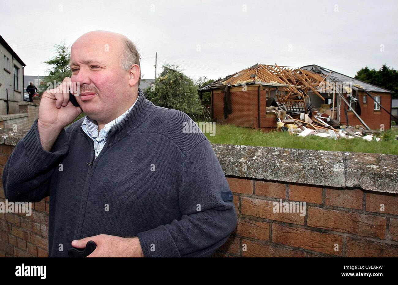 Dr Walter Boyd stands in front of the remains of the doctor's surgery ...