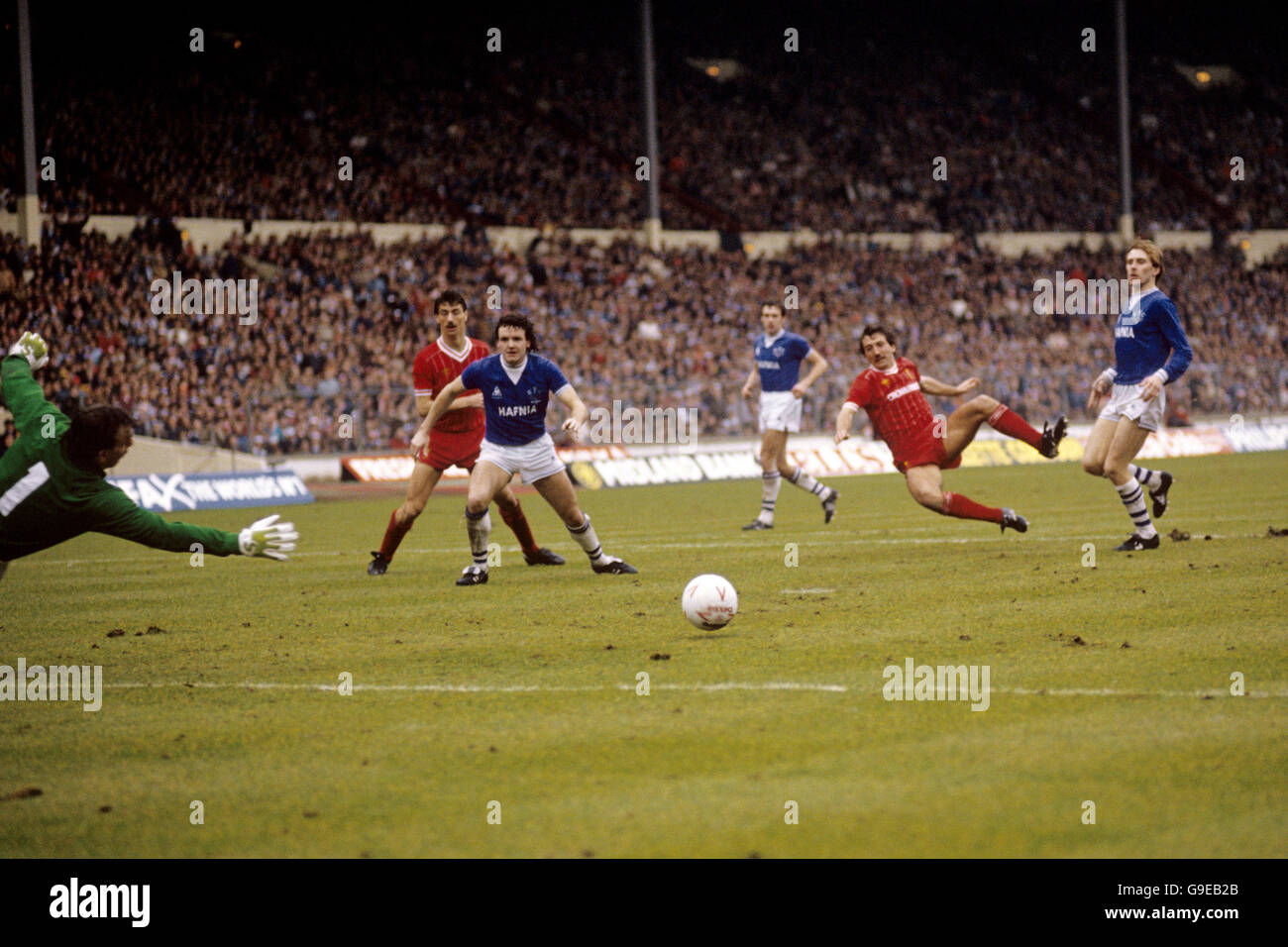 Liverpool's Alan Kennedy (second r) fires a shot at goal as Everton ...