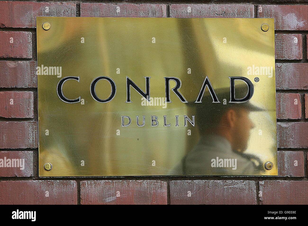 A Garda reflected in the sign at the Conrad Hotel, Dublin where Florida ...