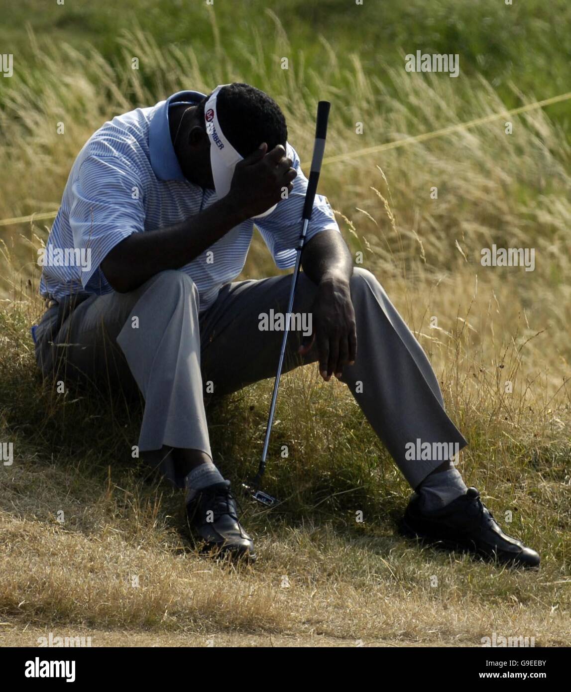 Fiji's Vijay Singh sits on the edge of the green before putting on the ...