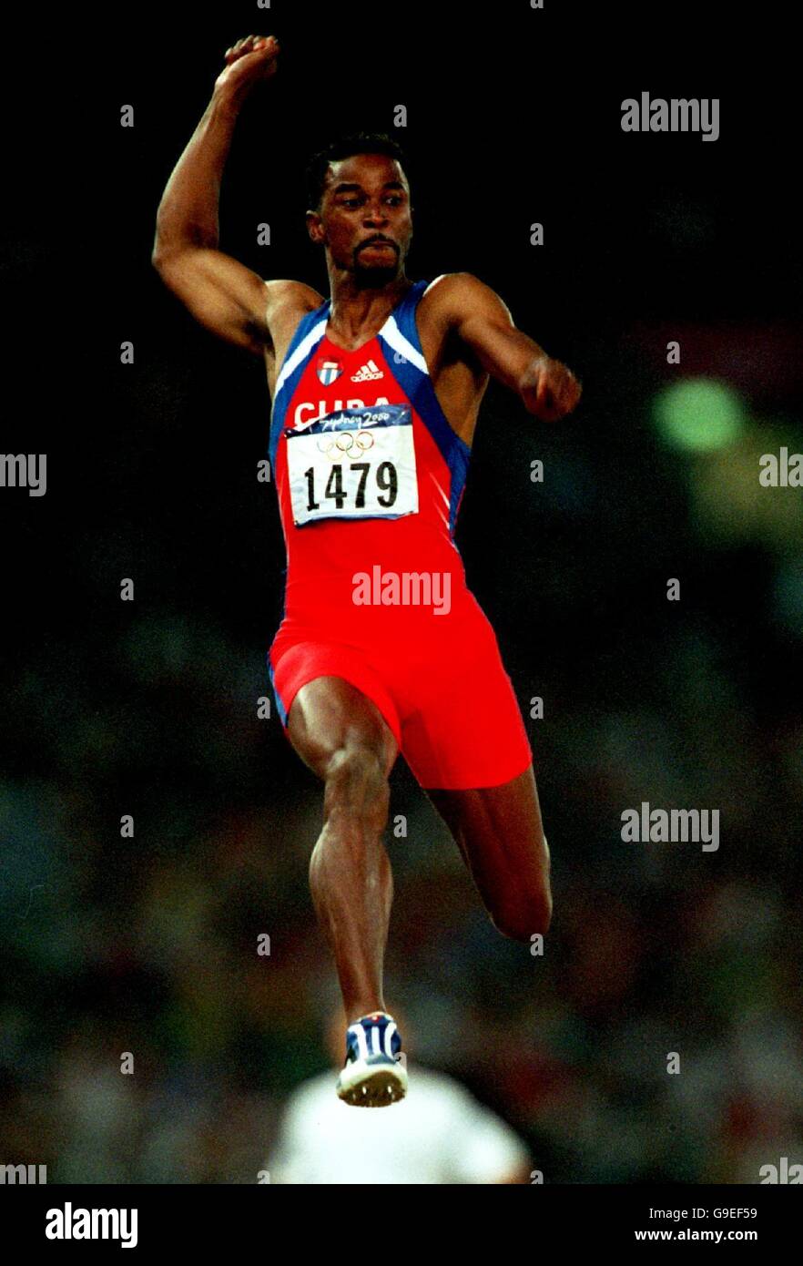 Cubas ivan pedroso leaps to win his gold medal hi-res stock photography ...