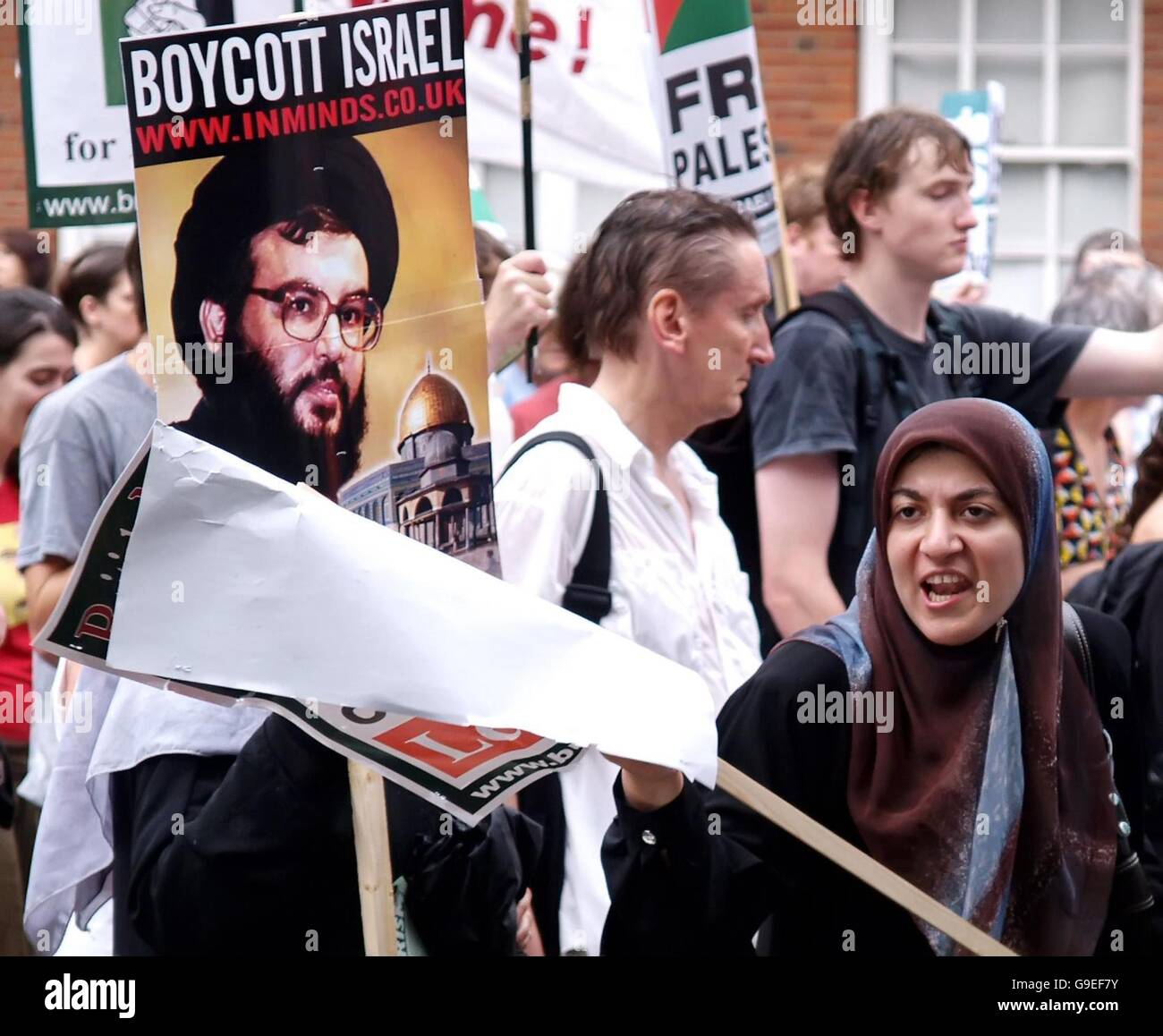 A demonstrator shouts slogans as she walks past, the U.S. embassy ...