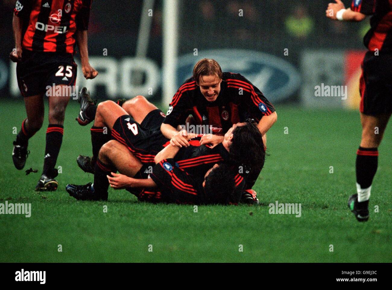 AC Milan's Demetrio Albertini (middle) is mobbed after scoring his team ...