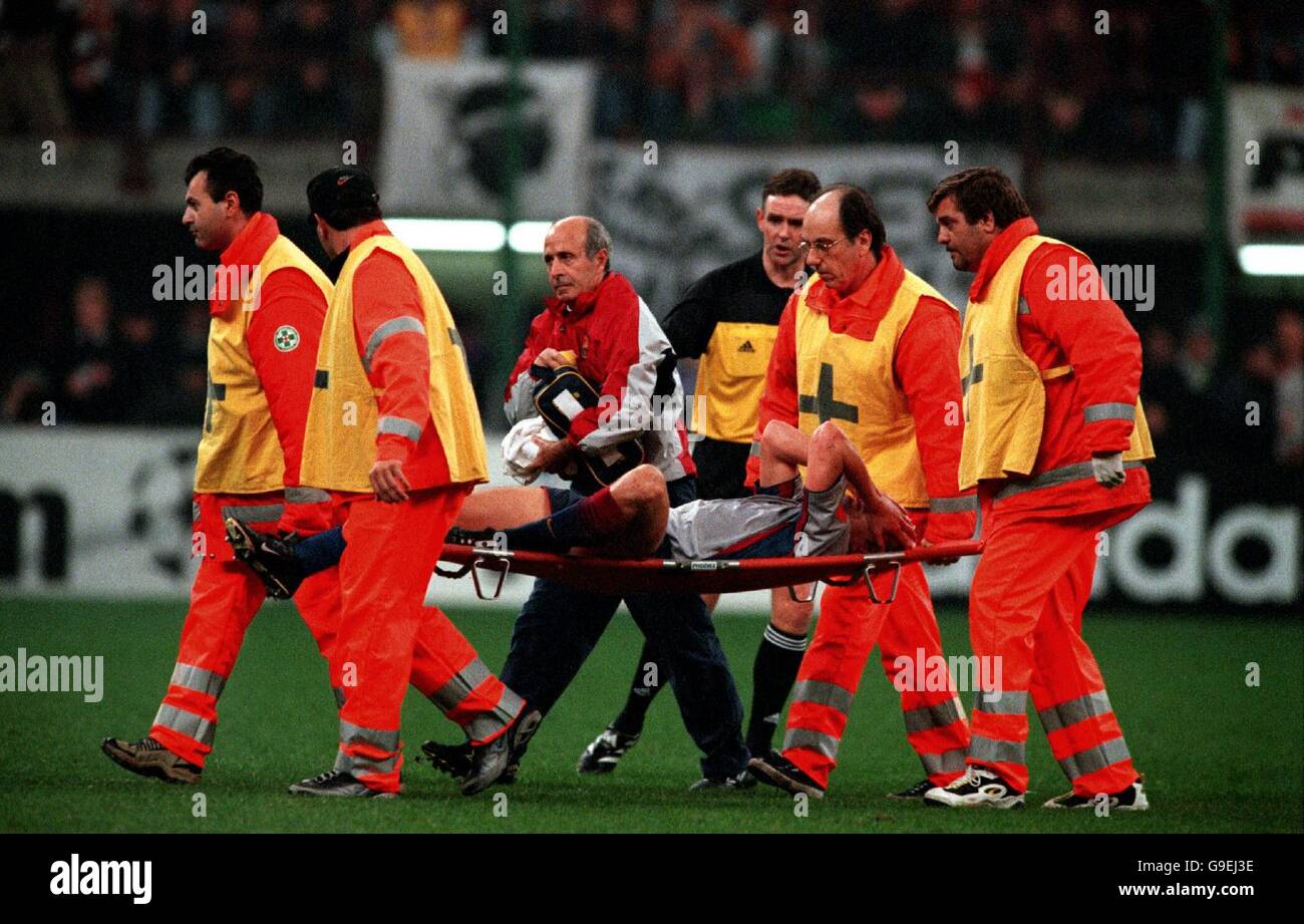 Barcelona's Emmanuel Petit follows teammate Philip Cocu off on a ...