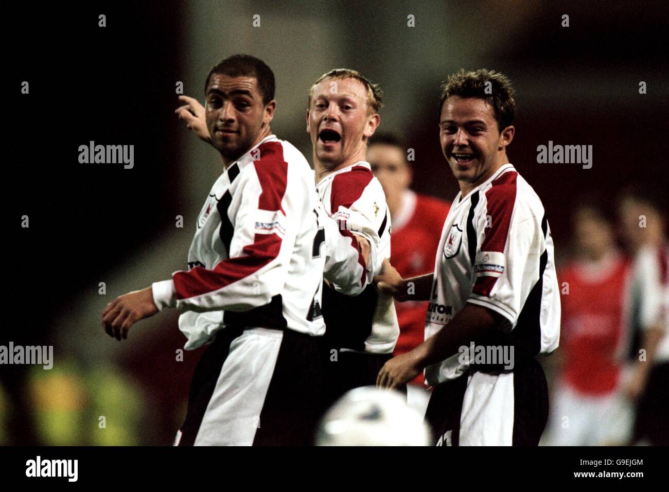 Darlington's Stuart Elliott (c) can't believe his luck as he celebrates ...