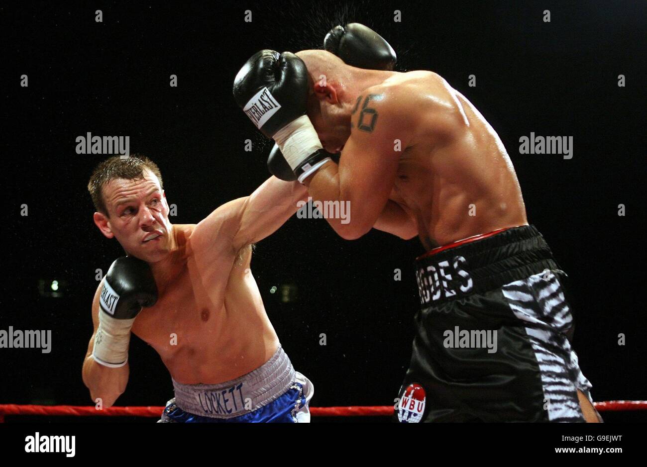 Gary Lockett (left) fires a punch at Ryan Rhodes during the for the WBU ...