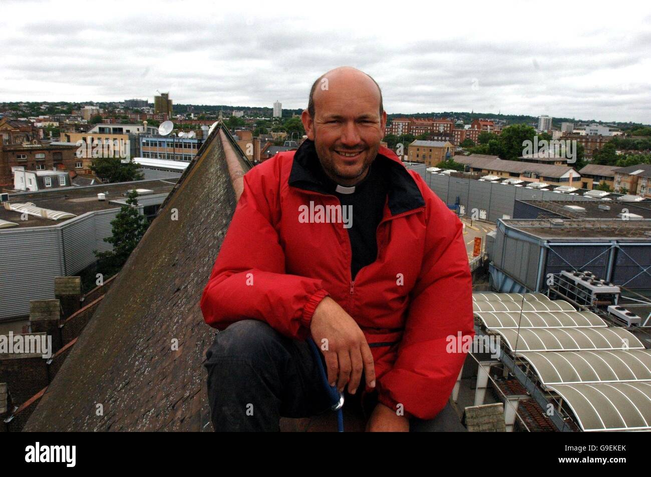 Vicar on church roof Stock Photo - Alamy
