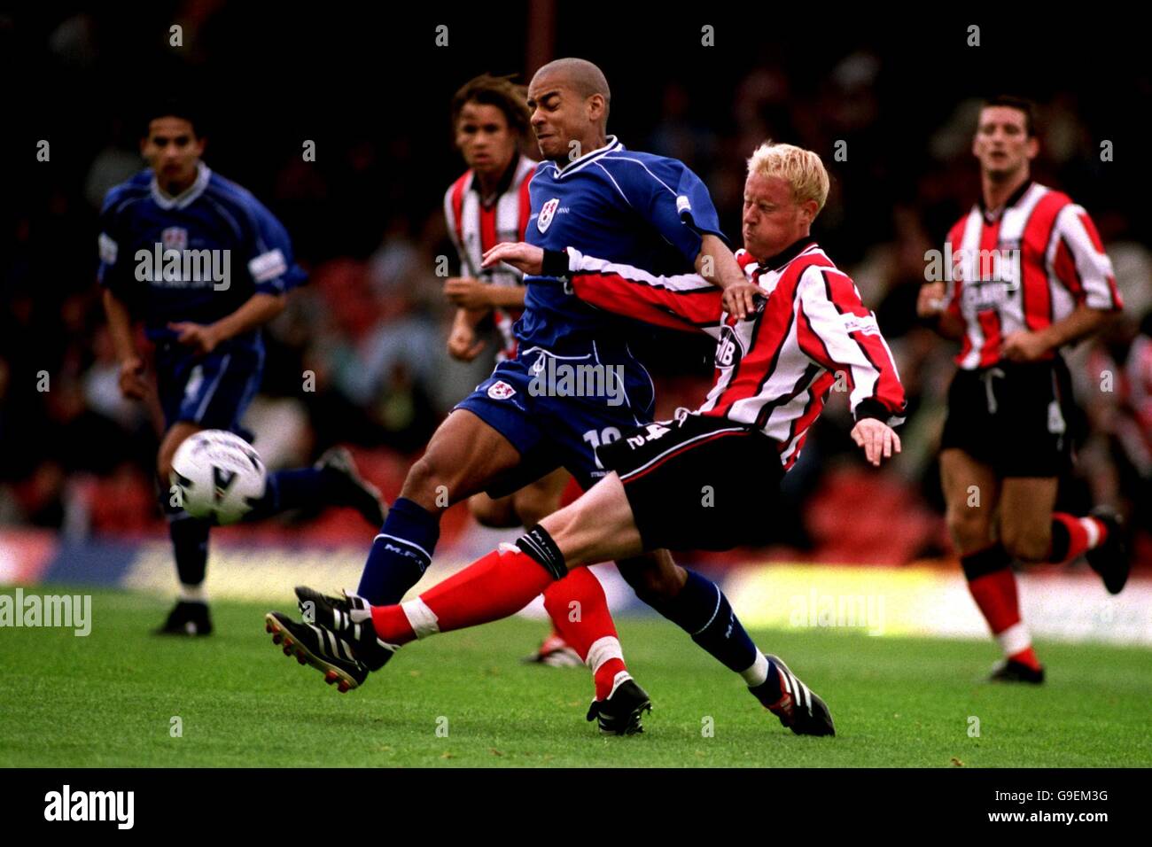 Millwalls steven reid is tackled by brentfords simon marsh hi-res stock ...