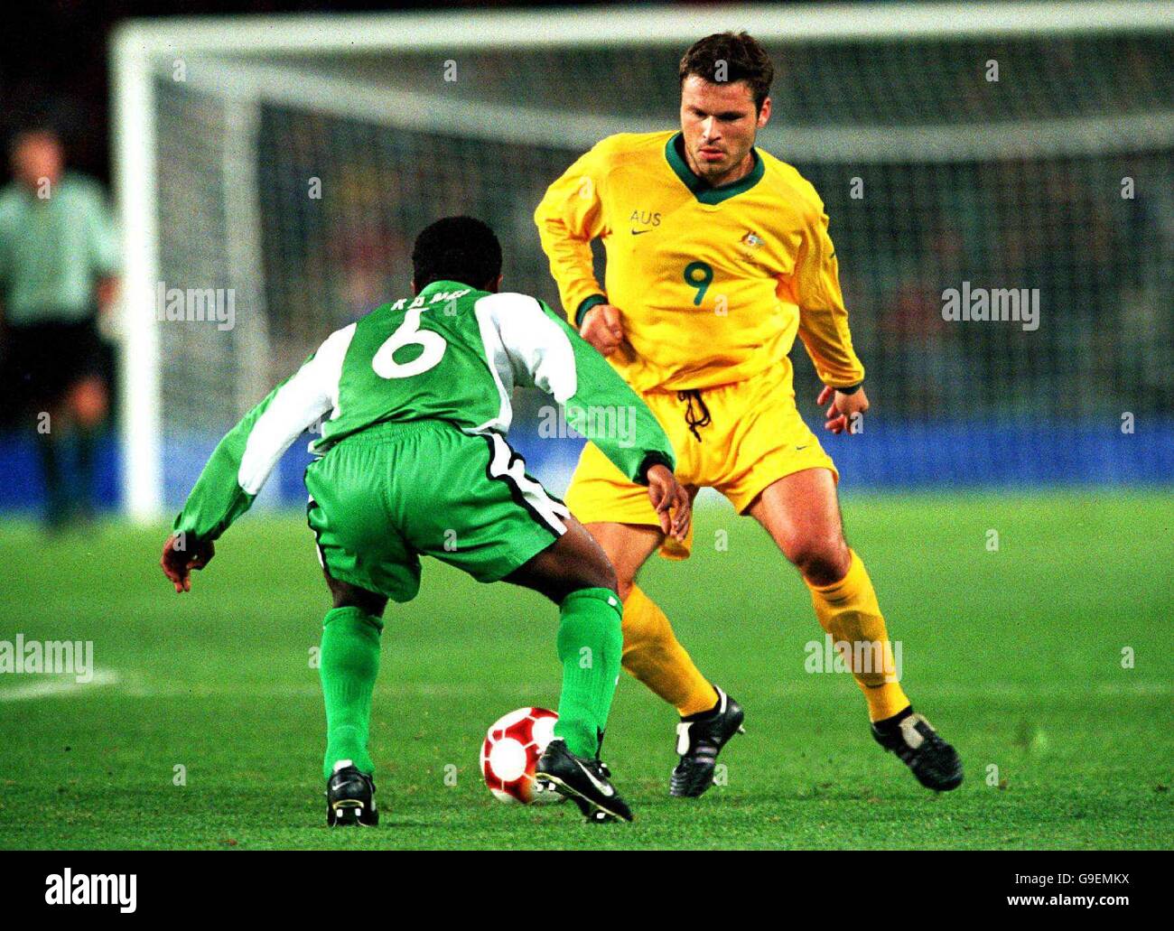 Australia's Mark Viduka (r) takes on Nigeria's Chris Kanu (l Stock ...