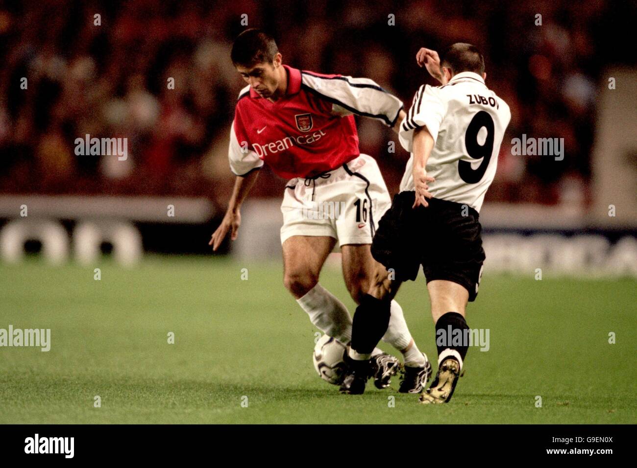 (L-R) Arsenal's Silvinho is tackled by Shakhtar Donetsk's Hennadii ...