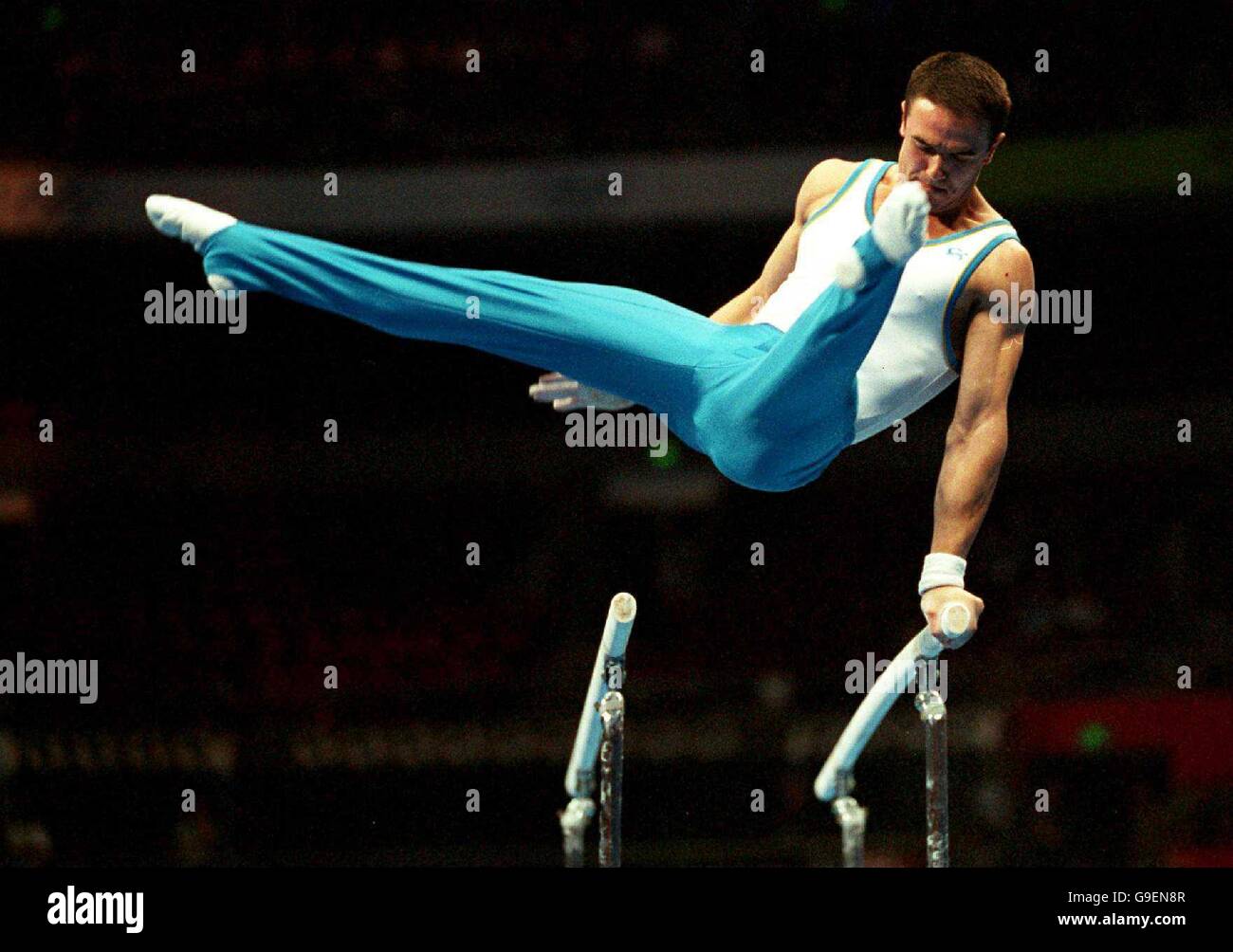 The Ukraine's Oleksandr Beresh in action on the parallel bars Stock ...