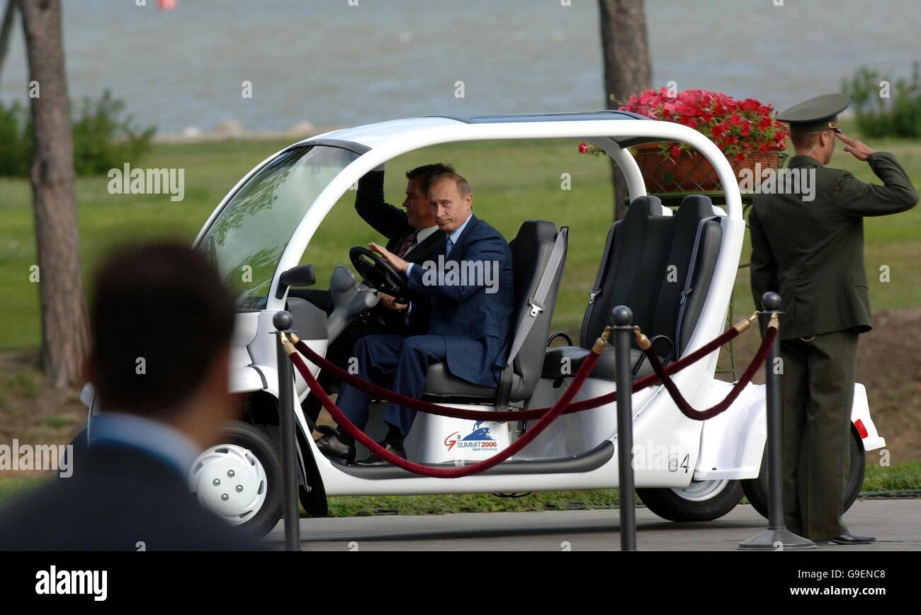 Russian President Vladimir Putin arrives by golf buggy for the first ...