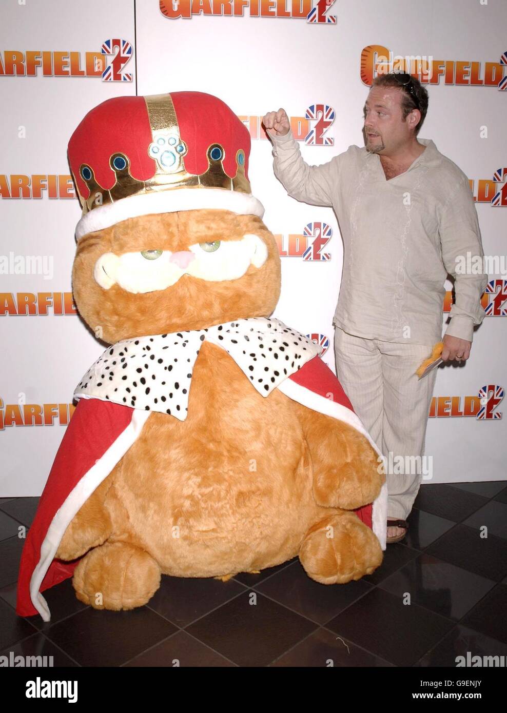 Actor John Thomson arrives for the premiere of Garfield 2 at the VUE ...