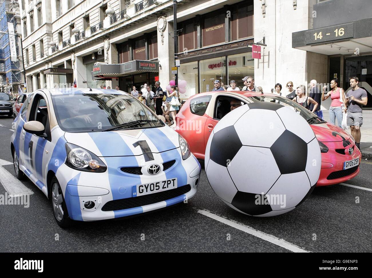 Toyota hatchbacks play football and perform stunts in a parade ...