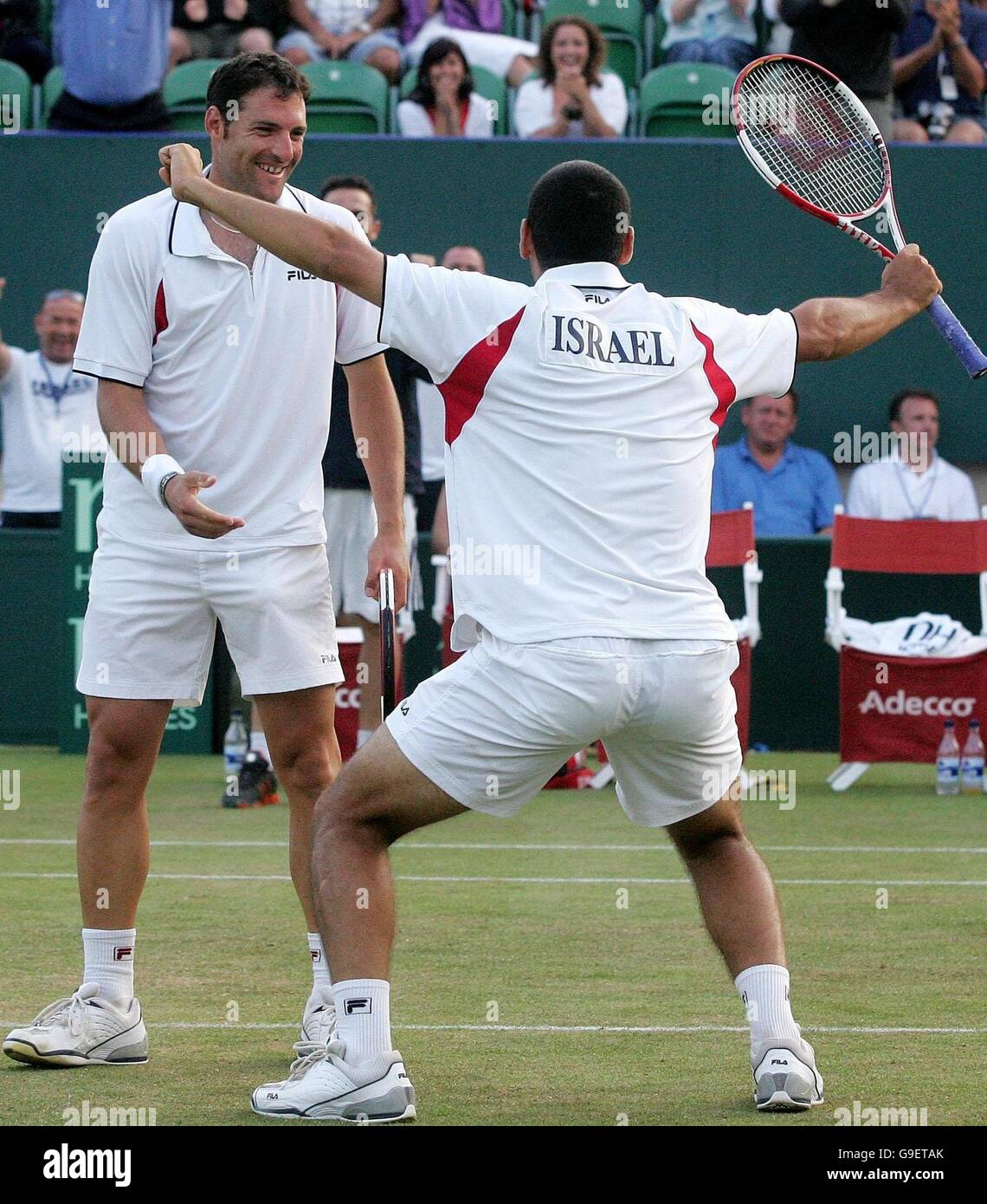 Israel's Andy Ram celebrates with team-mate Johnathan Erlich (facing ...
