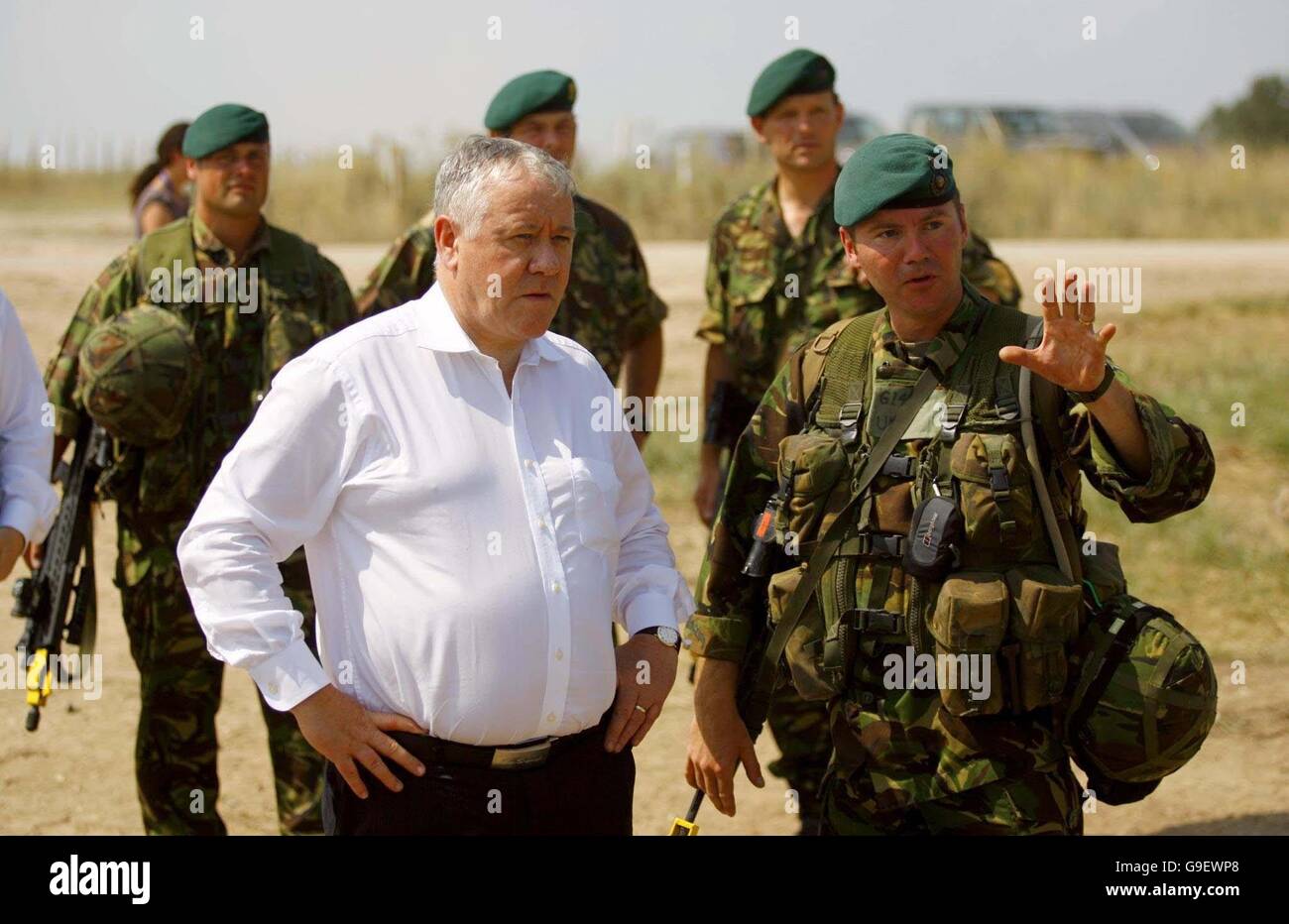 Armed Forces Minister Adam Ingram (white shirt) watches soldiers from 3 ...