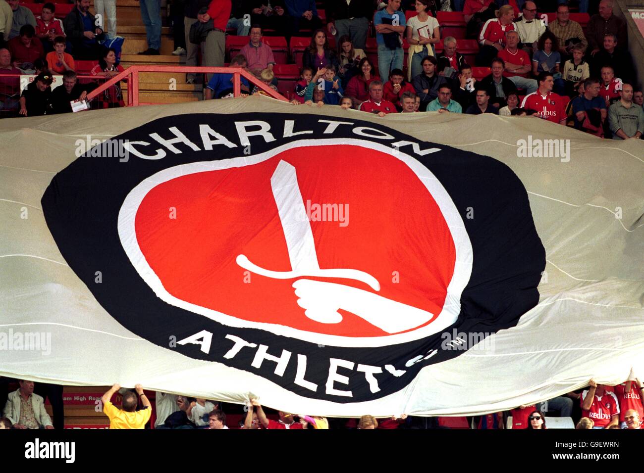 A giant Charlton Athletic flag is passed over the crowd Stock Photo - Alamy