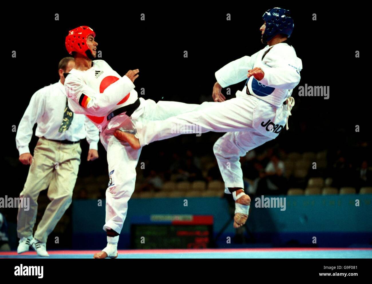 Sydney 2000 Olympic Games - Taekwondo - Men's 80kg. Jordan's Mohamed Alfararjeh (r) fighting ...