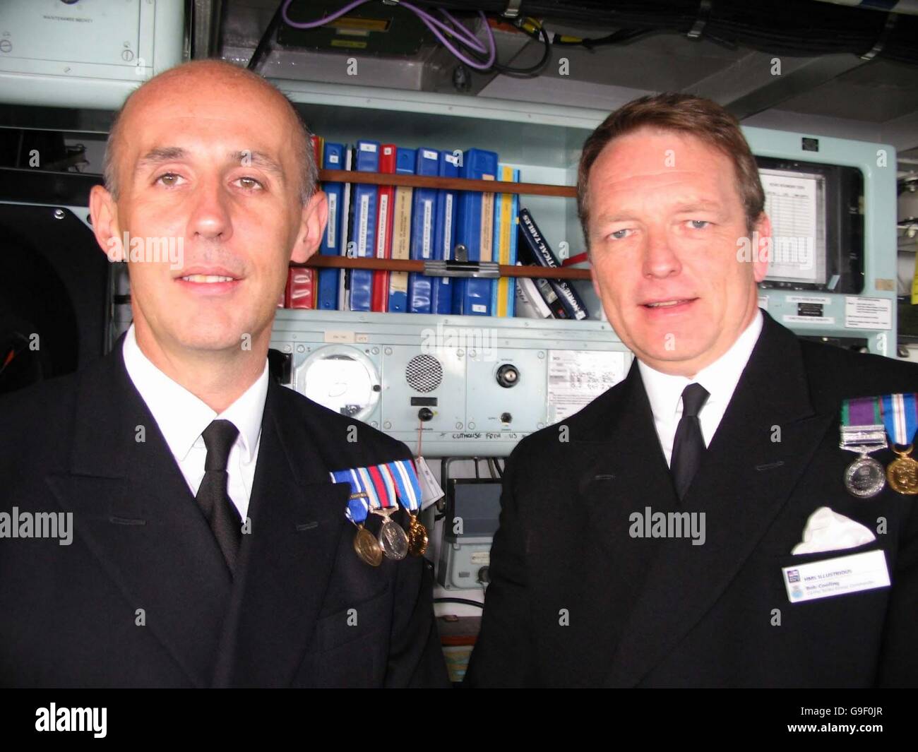 HMS Gloucester's commanding officer, Commander Mike Paterson, (left ...