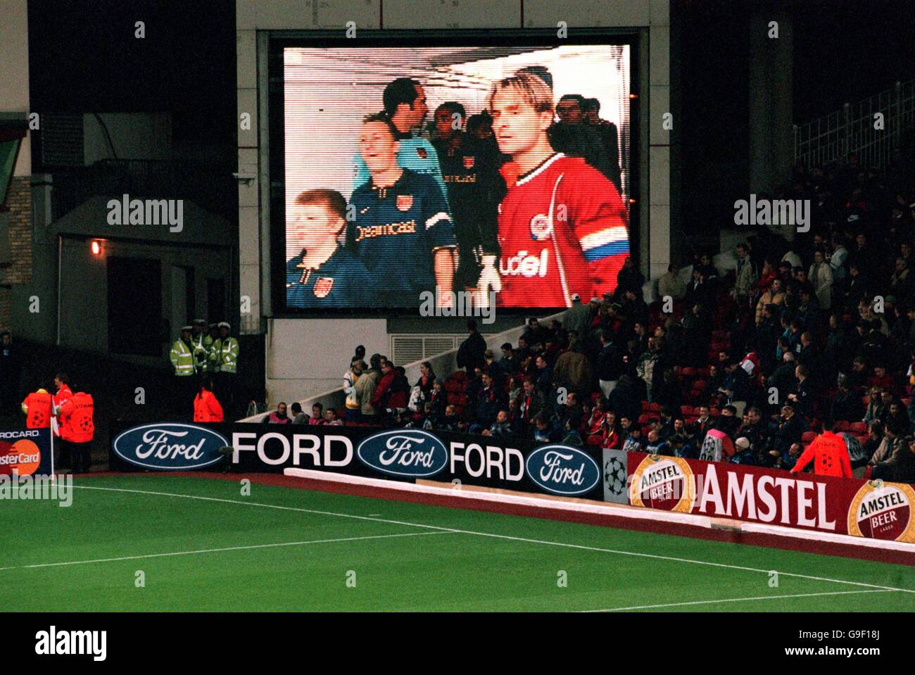 The Highbury giant screen shows the two teams in the tunnel, waiting to ...
