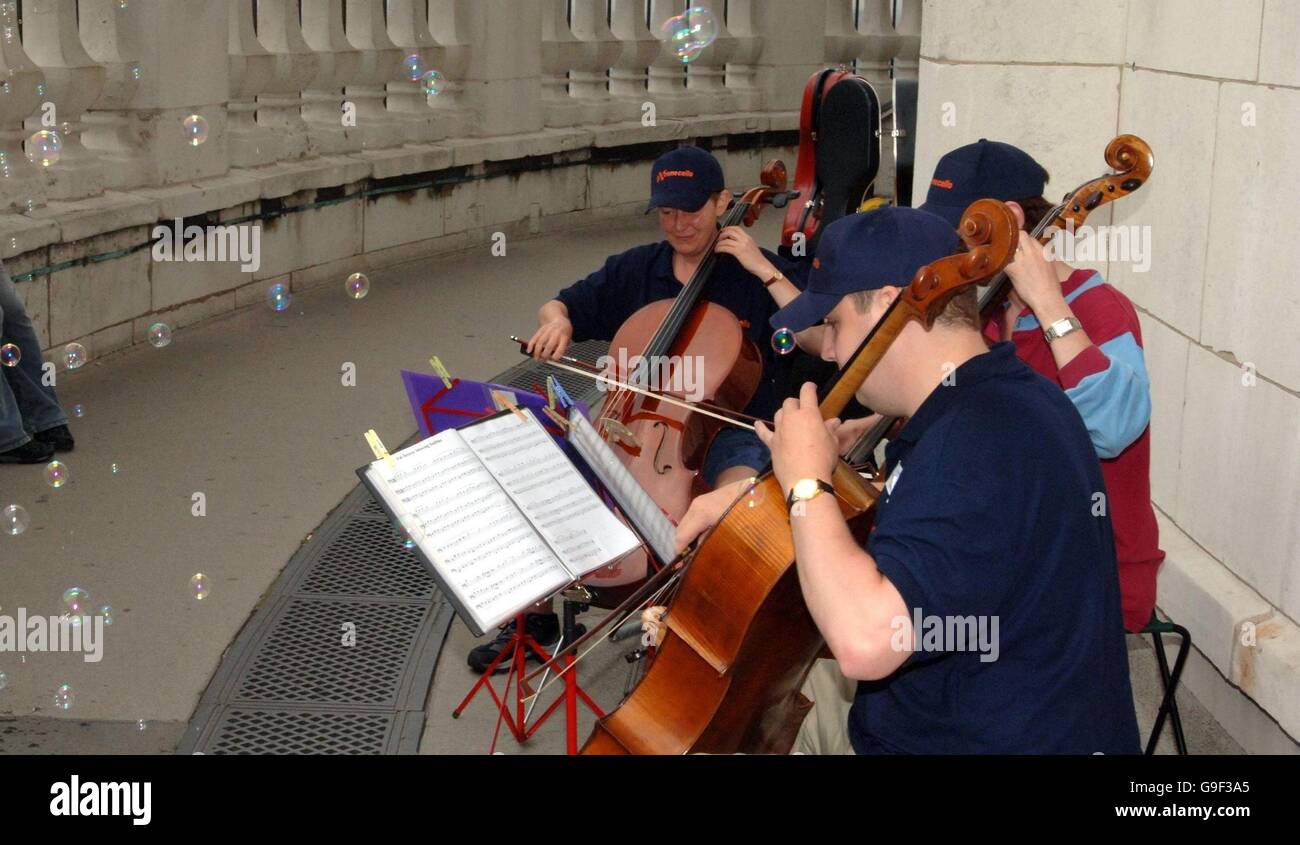 ExtremeCello get showered in bubbles as they play on the roof of St ...