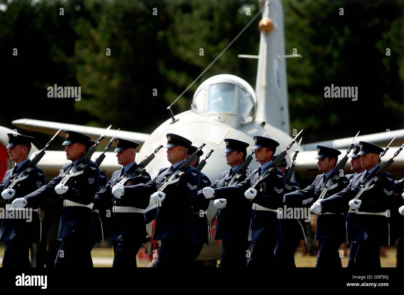 Servicemen from RAF 39 Squadron, march past a Canberra at RAF Marham ...