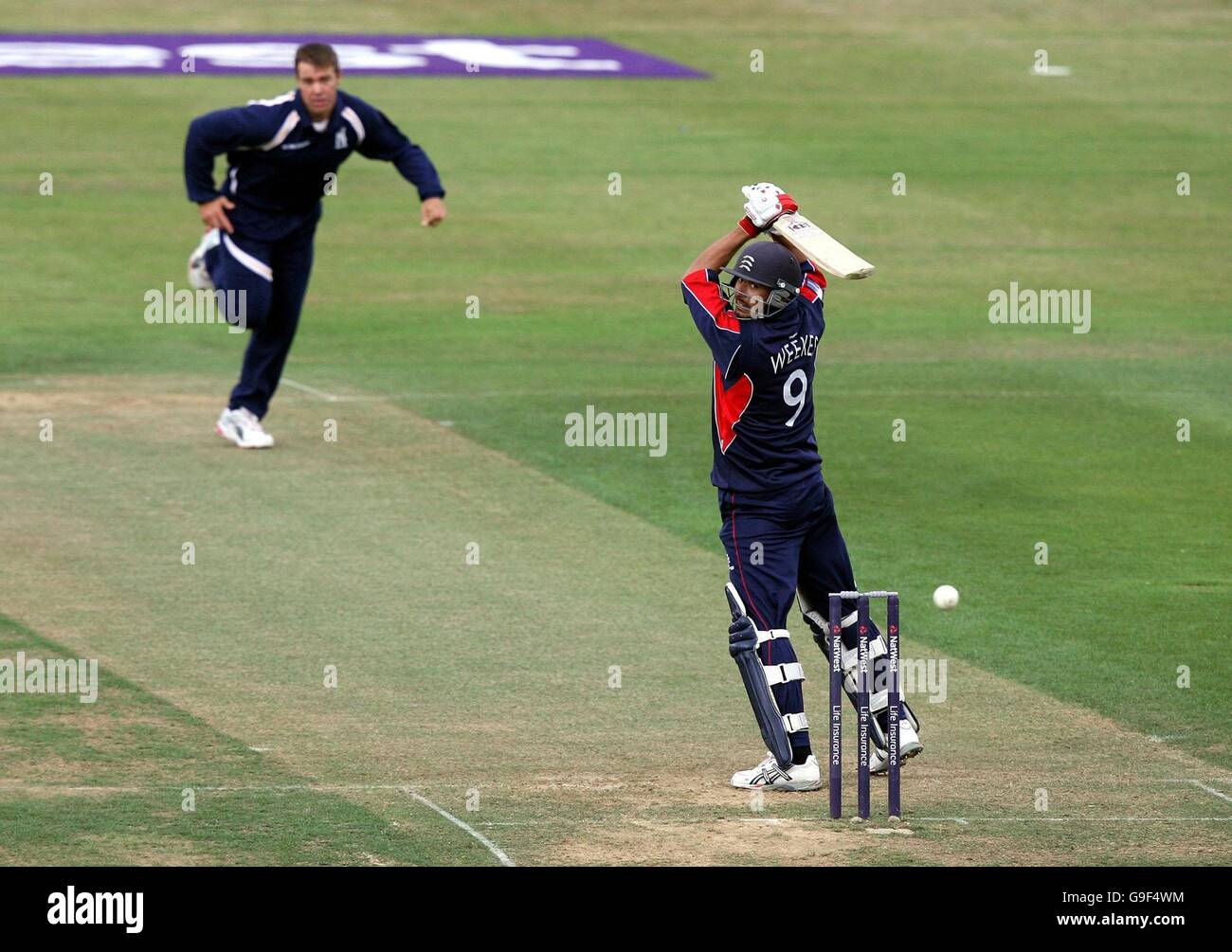 Middlesex's Paul Weekes (right) edges a delivery from Wariwckshire's ...