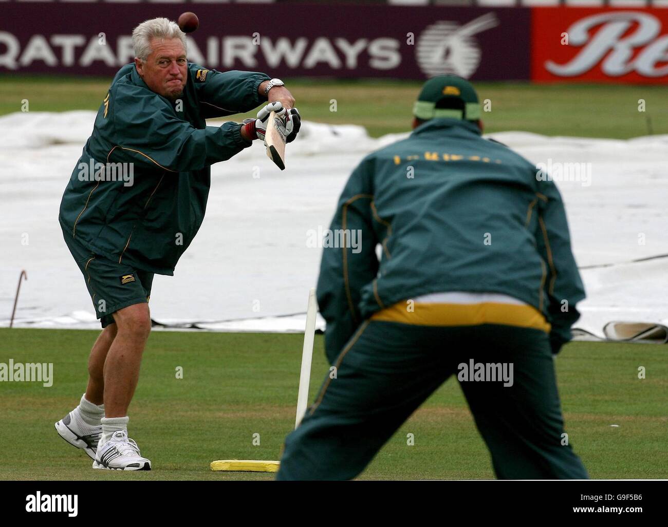 Pakistan coach Bob Woolmer hits a ball to his slip fielders during a ...