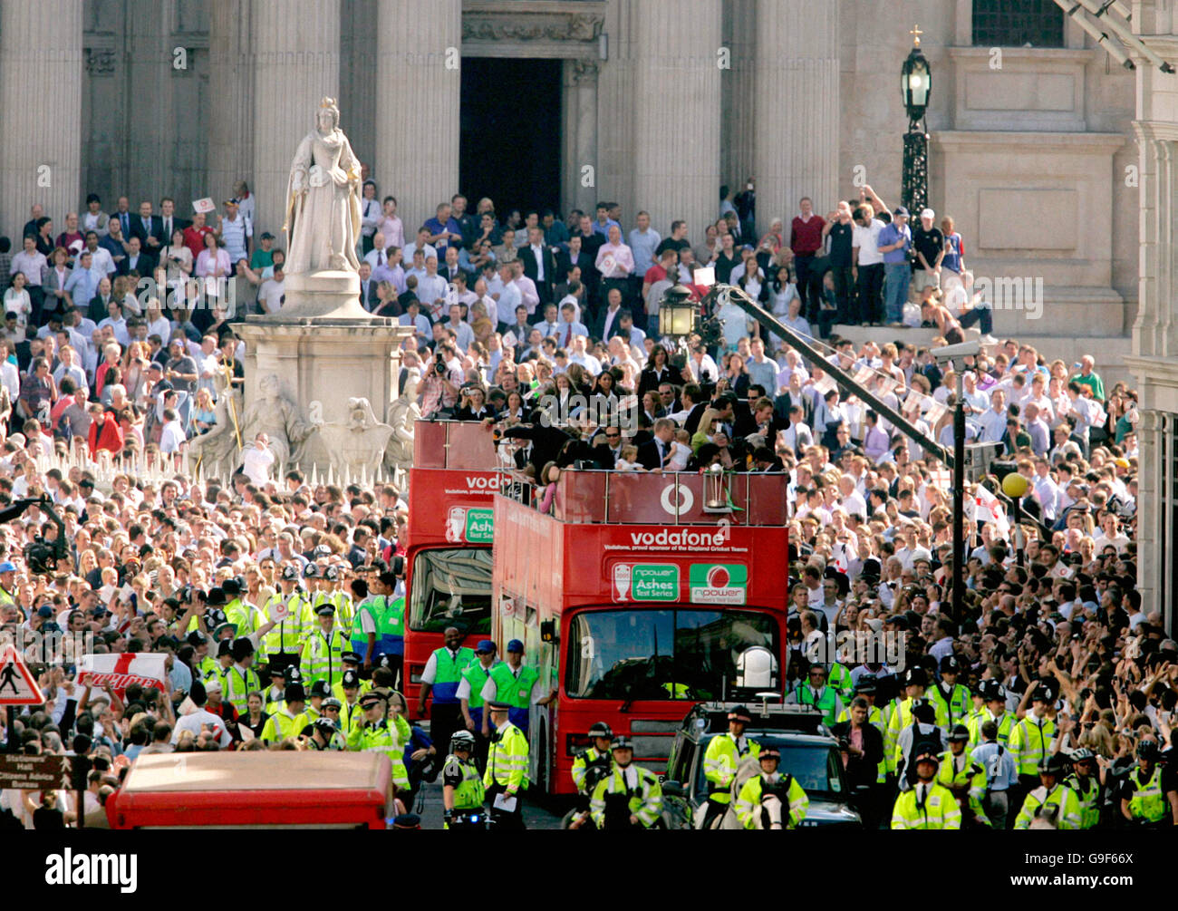 The England cricket team ride on an open-top bus during a victory ...