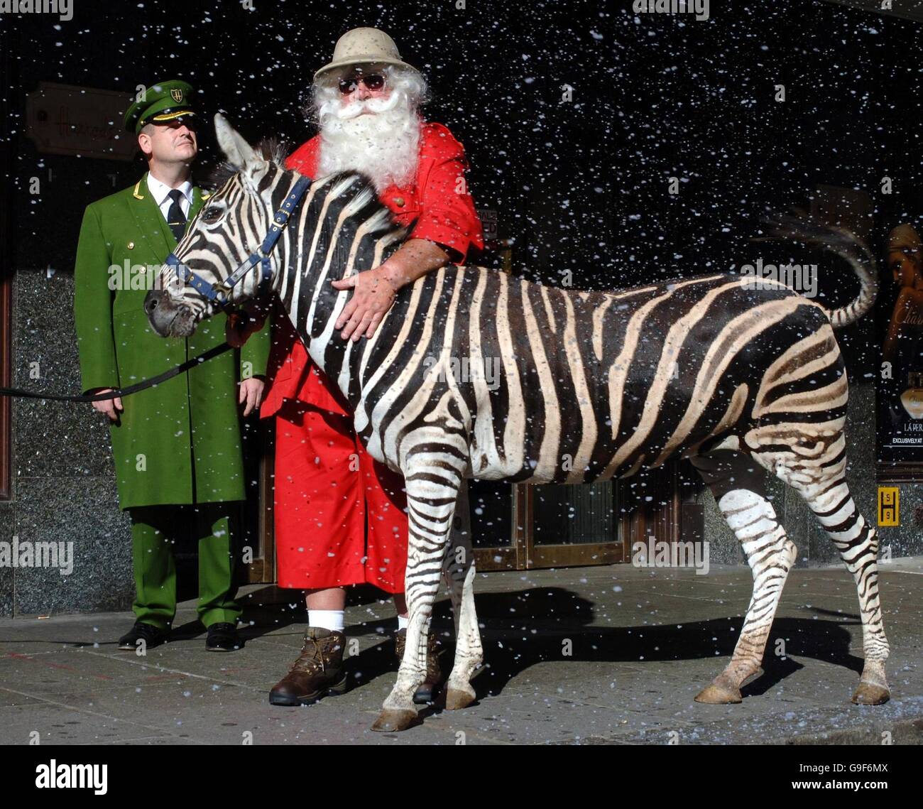 Santa Claus stands outside department store Harrods in London, as the ...