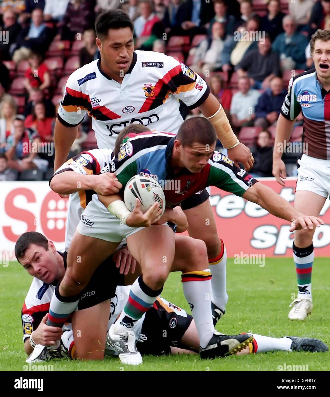 Harlequin's Henry Paul breaks away from the Bradford Bulls defence ...