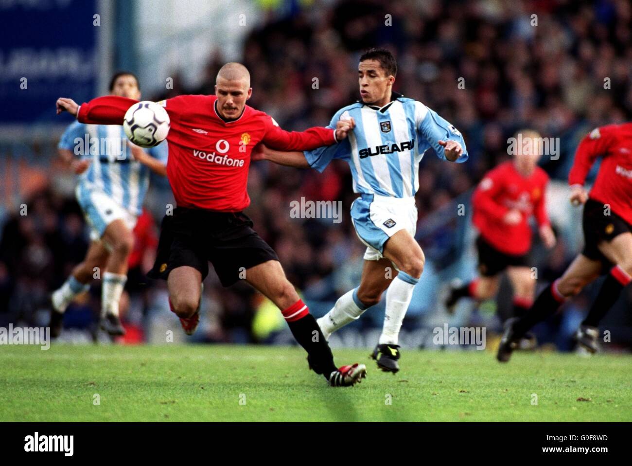 Manchester United's David Beckham (l) battles against Coventry City's ...