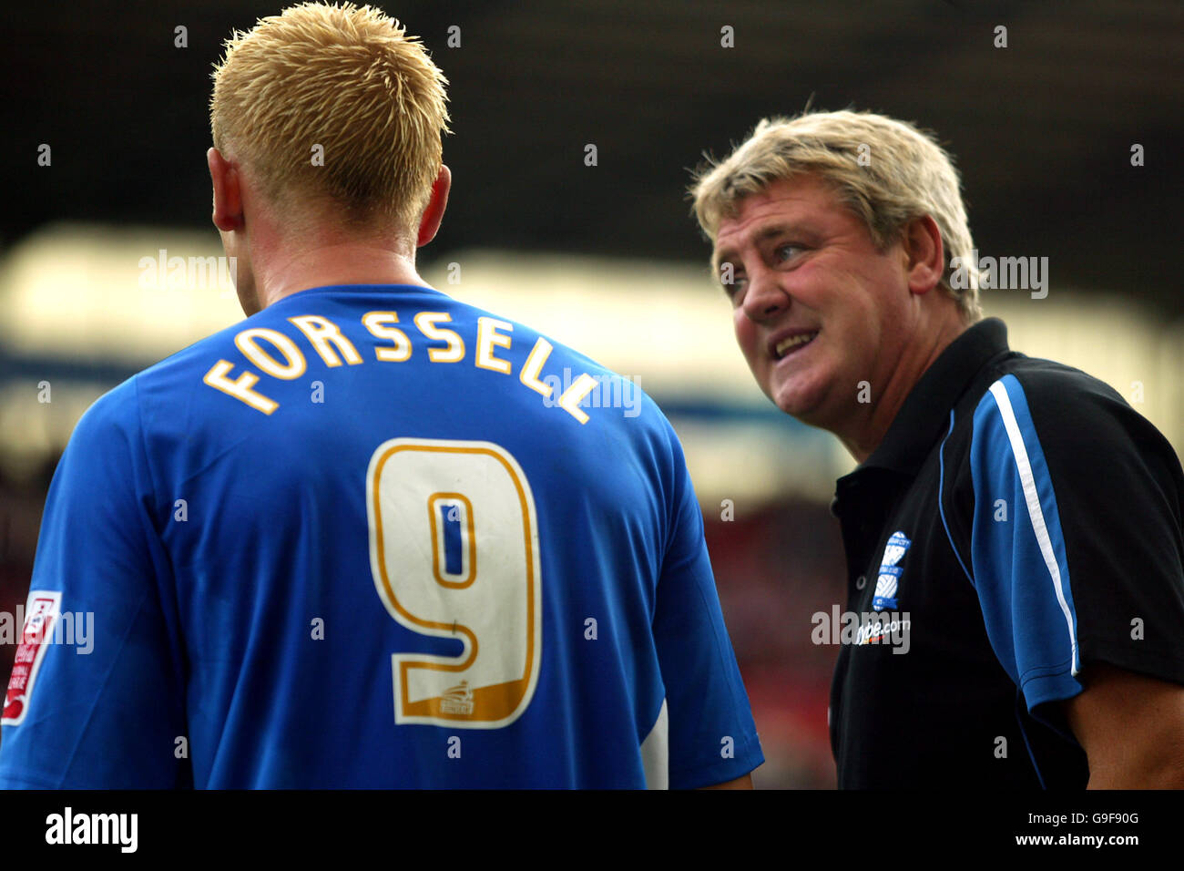 Birmingham City's manager Steve Bruce talks to his centre forward ...