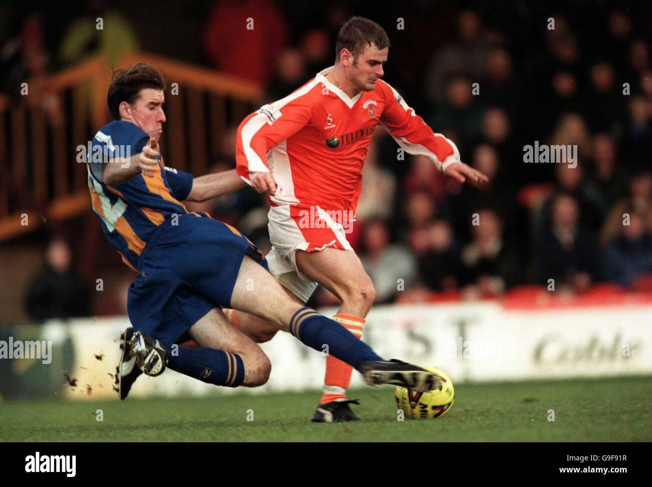 Blackpool's John Murphy (r) is tackled by Shrewsbury Town's Peter ...