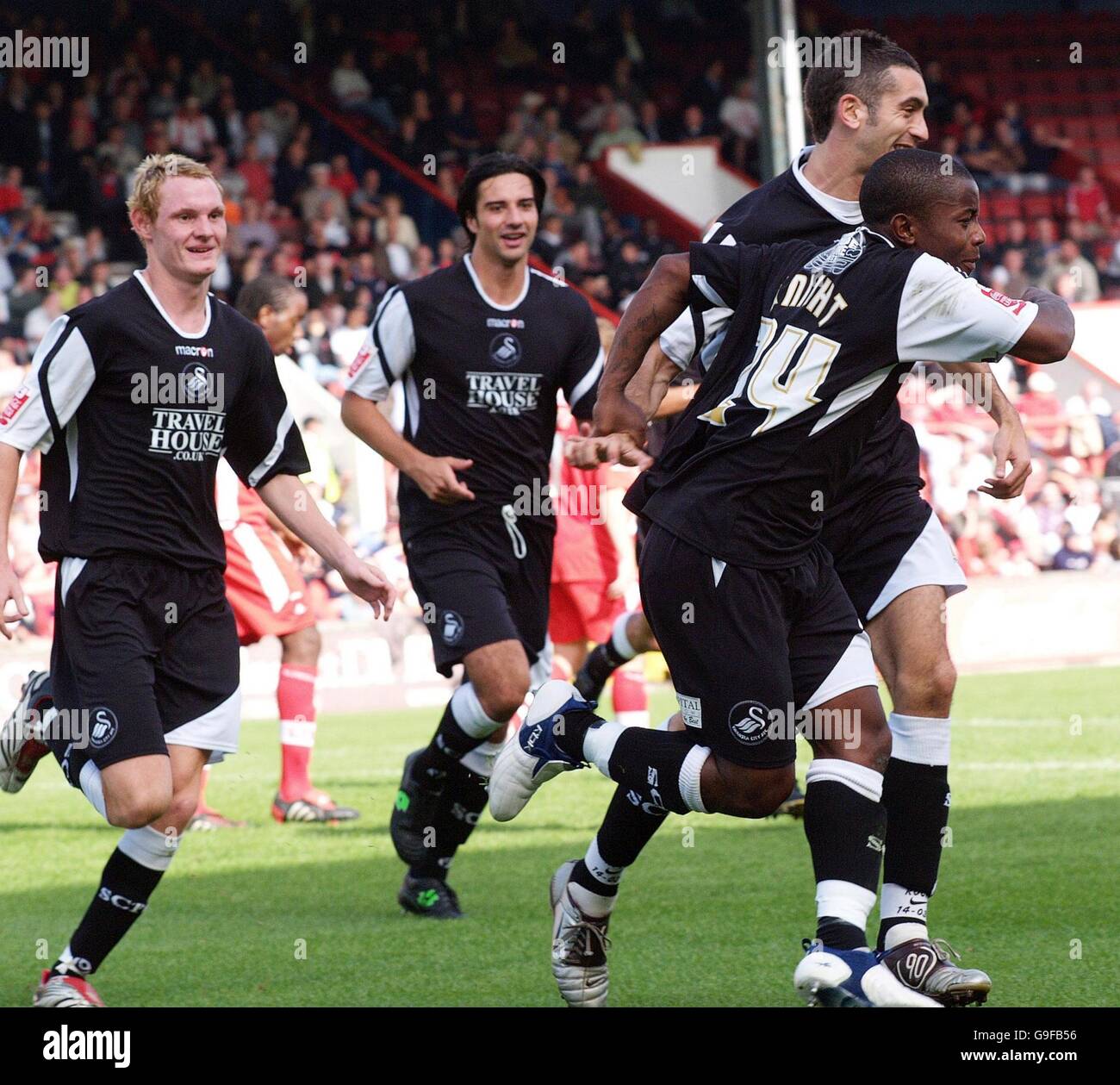 Swansea's Leon Knight (front) celebrates his goal against Leyton Orient ...