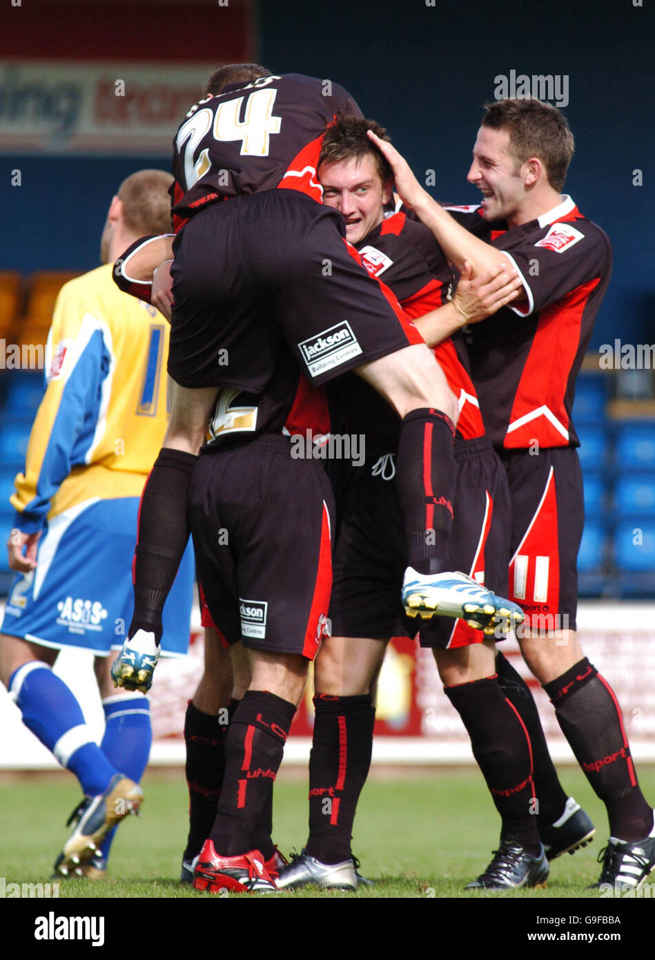 Lincoln City's players celebrate Jamie Forrester fourth goal of the ...