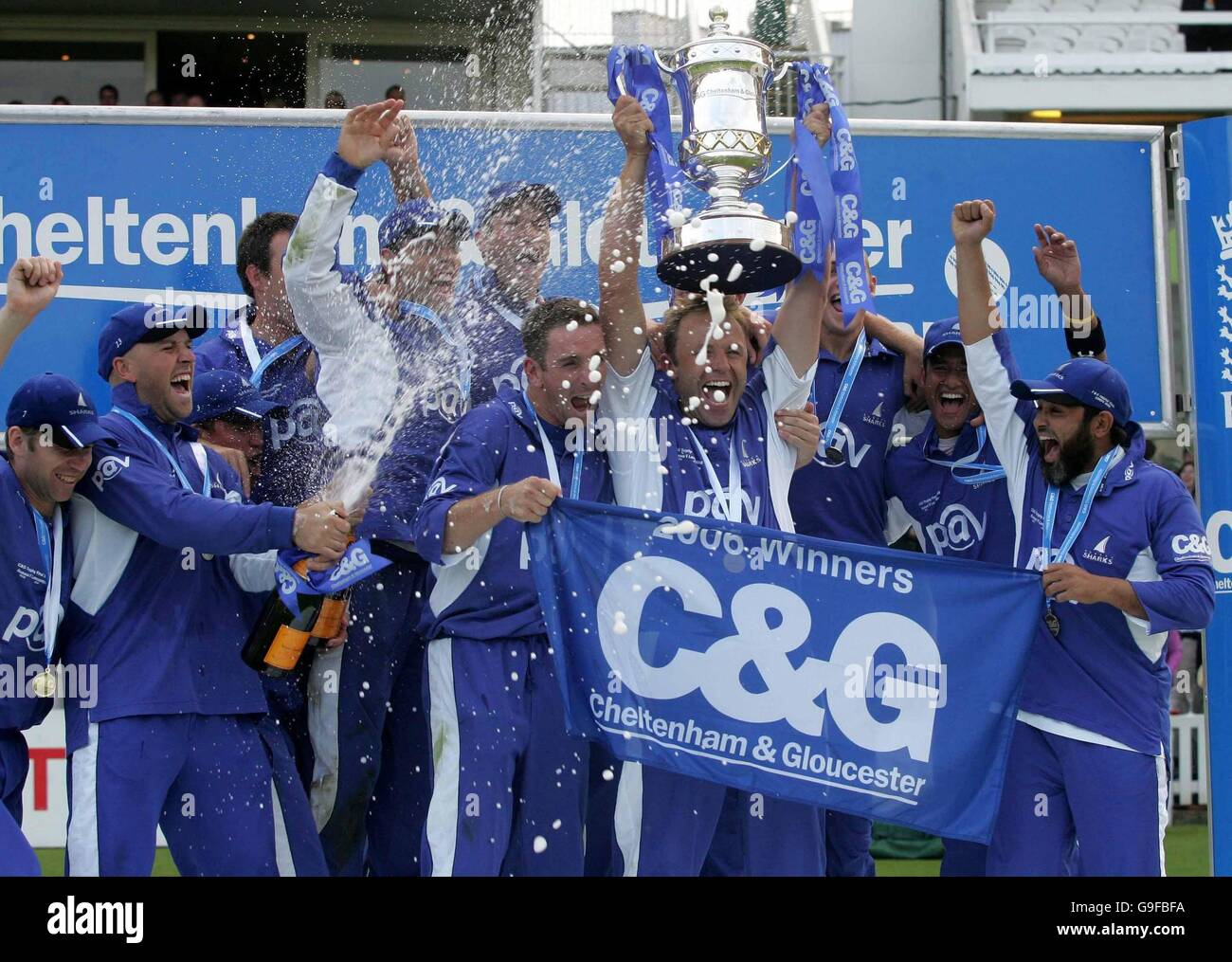 Sussex captain Chris Adams lifts the trophy after his team beat ...