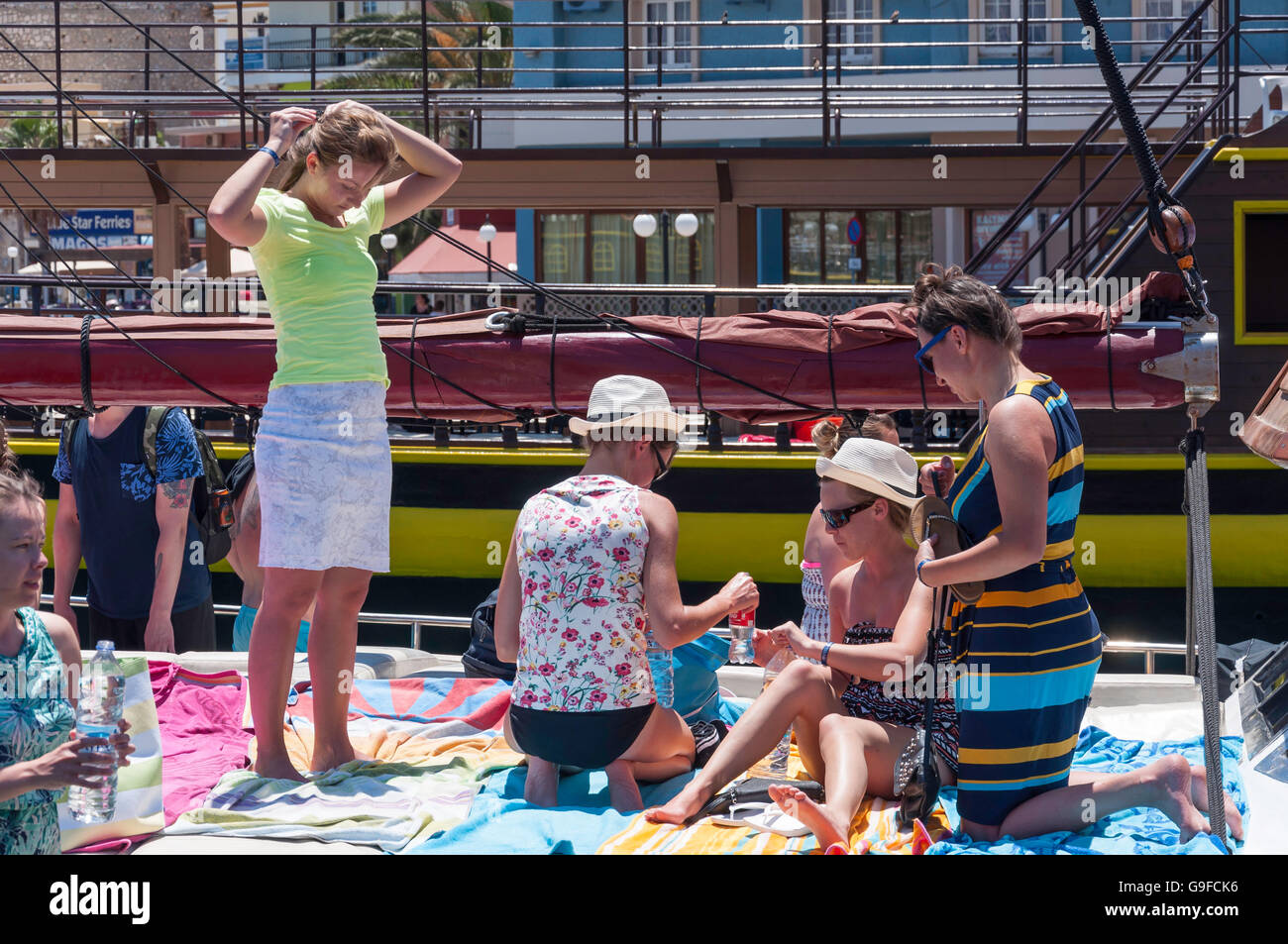 Young women on day cruise boat, Pothia (Pothaia), Kalymnos, The ...