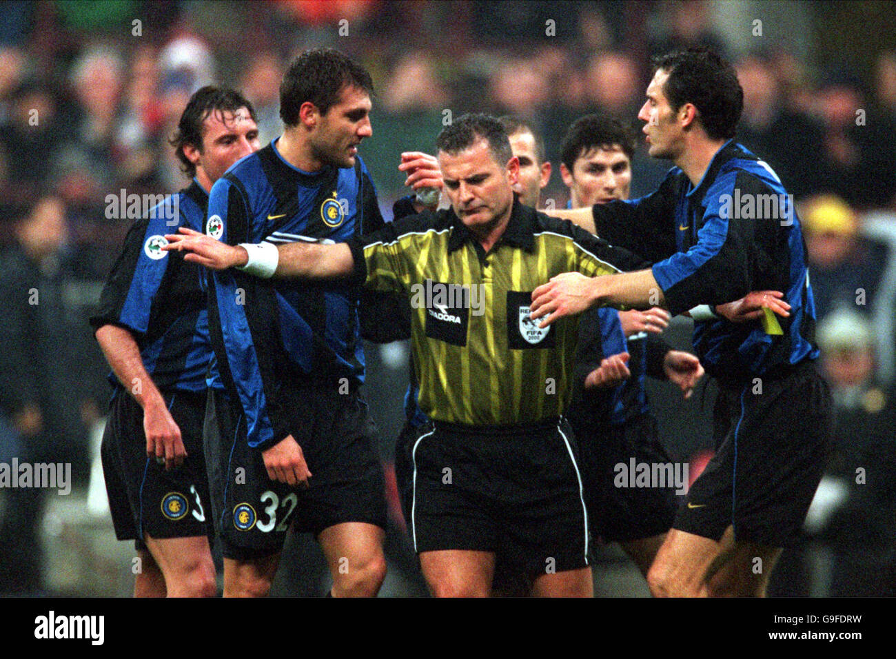 Referee Stefano Braschi (c) is crowded by Inter Milan players after the ...