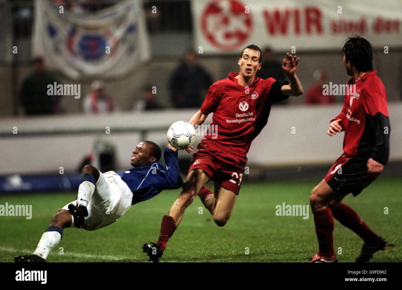 Kaiserslautern's Jeff Strasser (r) knocks Rangers' Rod Wallace (l) off ...