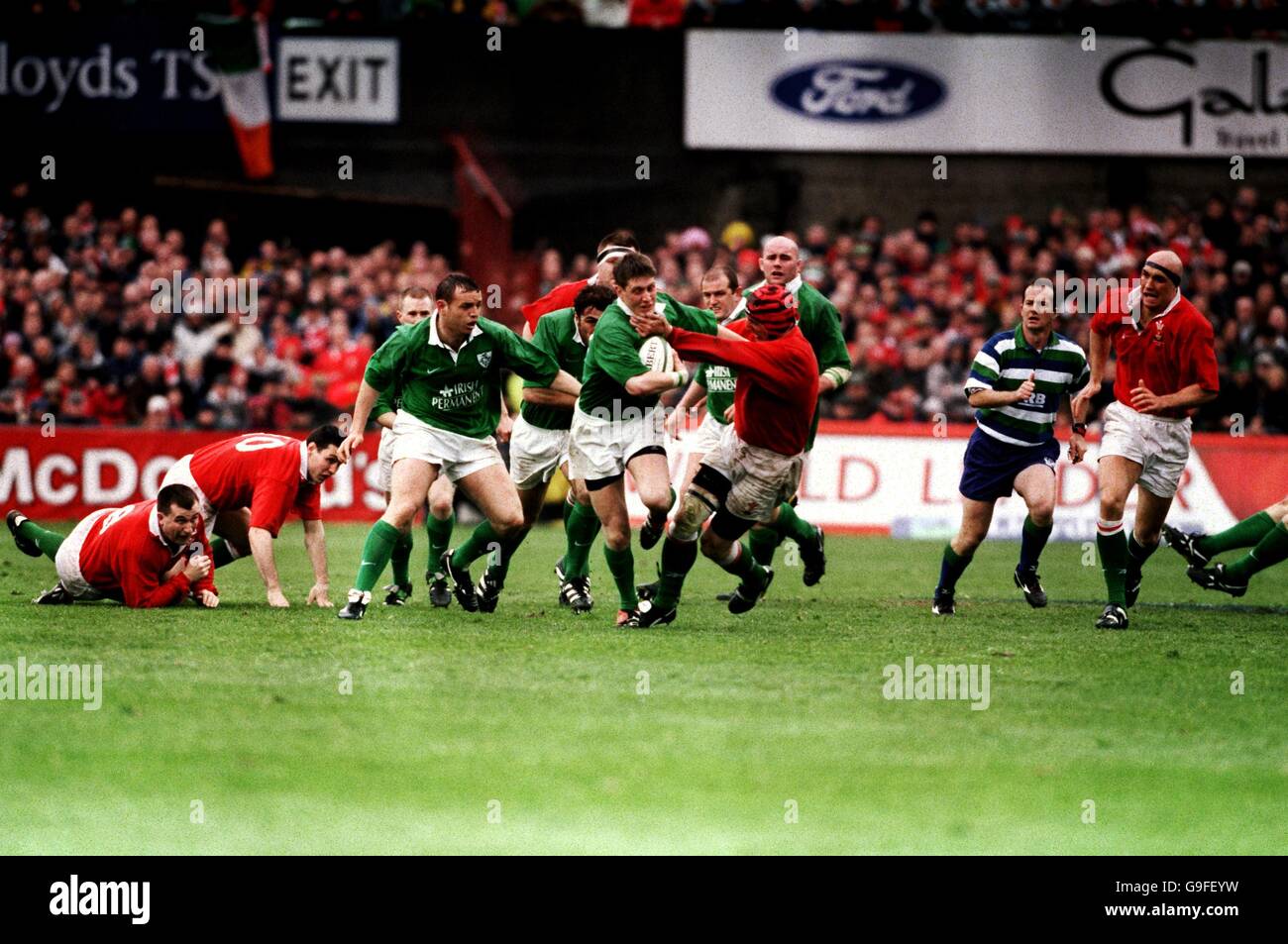 Wales' Rupert Moon (r) comes across to tackle Ireland's Ronan O'Gara (l ...